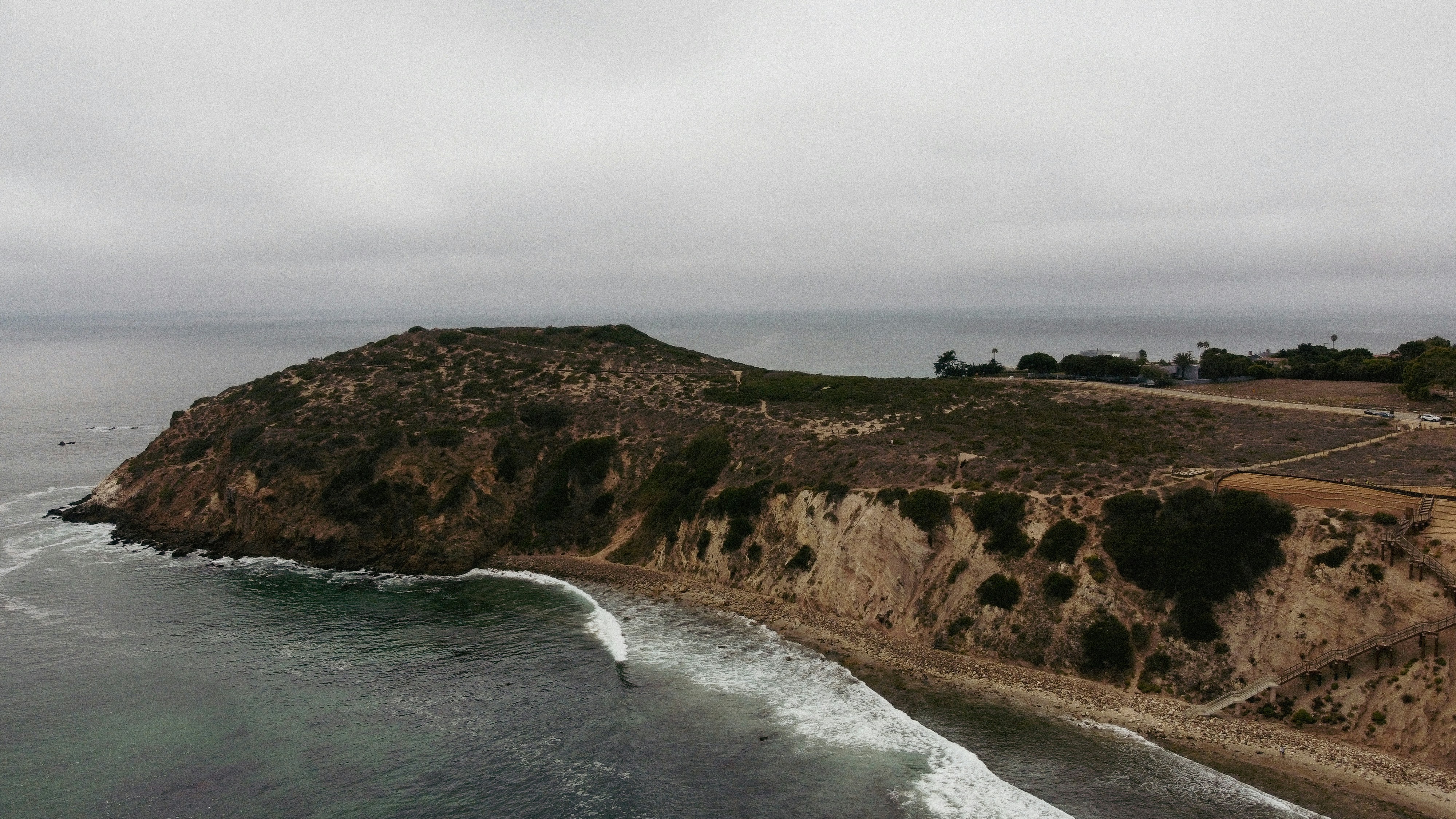 An aerial view of a beach and a cliff photo – Free Point dume Image on ...