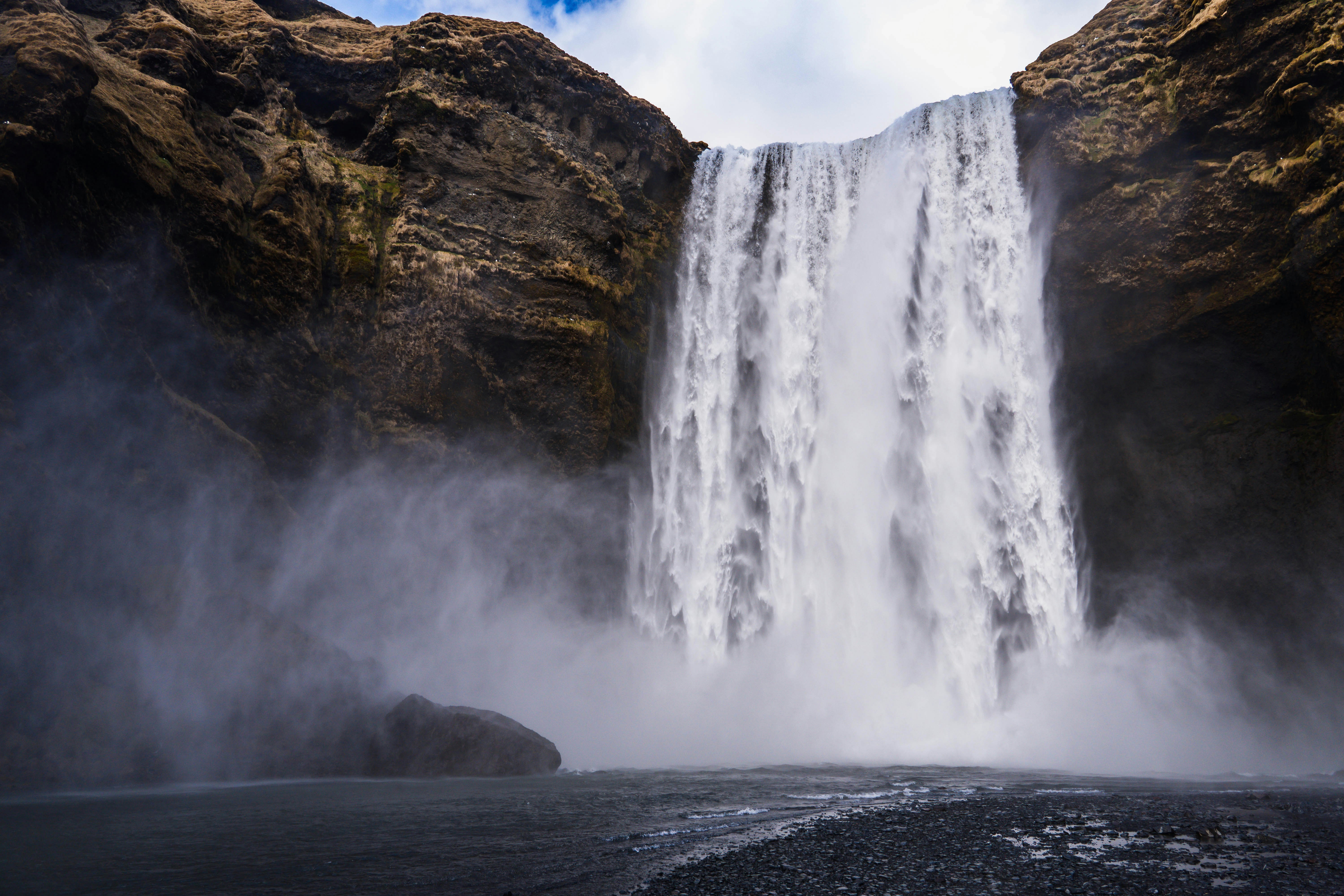 A very tall waterfall with lots of water coming out of it photo – Free ...