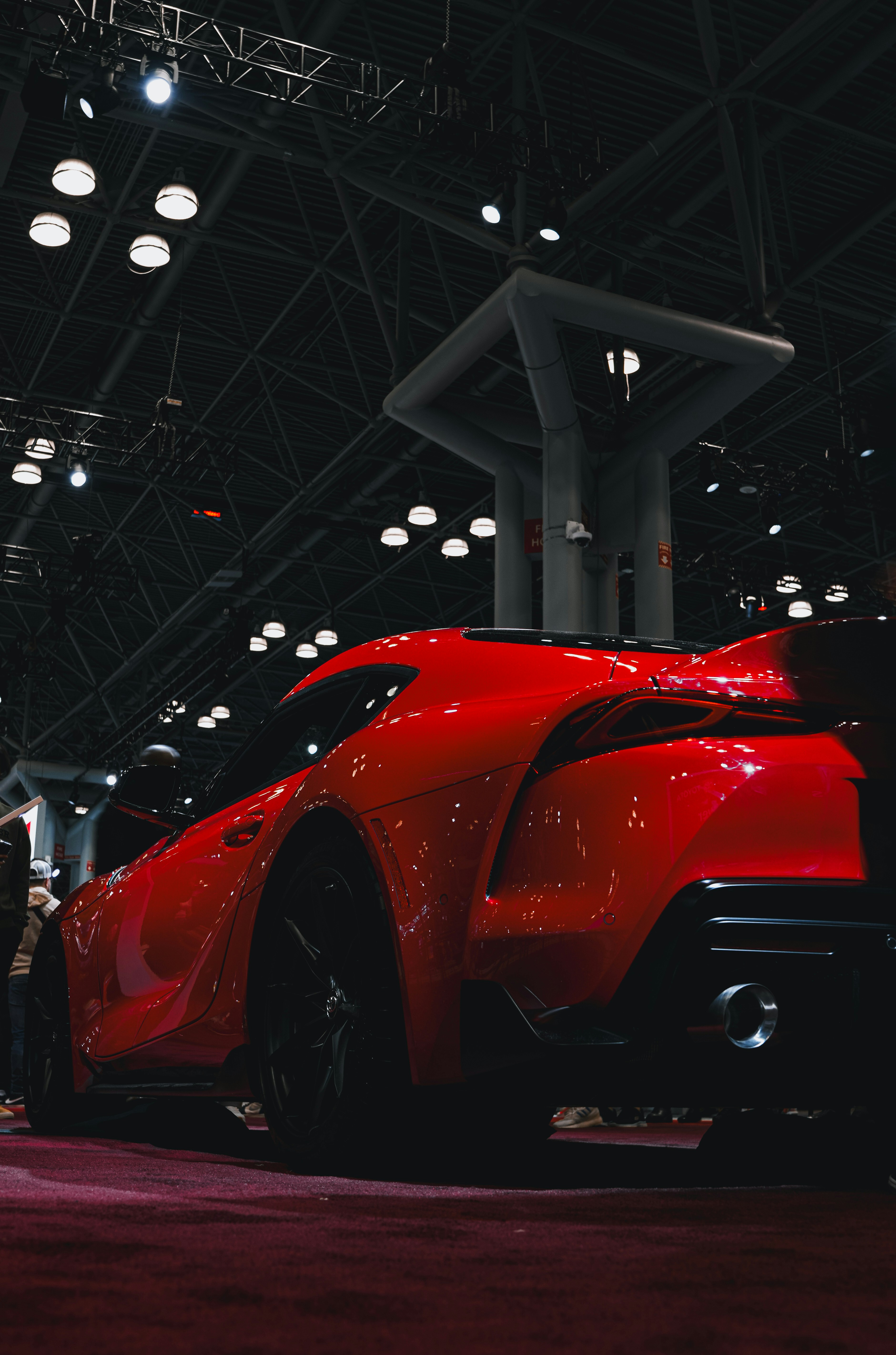 A red sports car on display at a car show photo – Free Sexy Image on ...