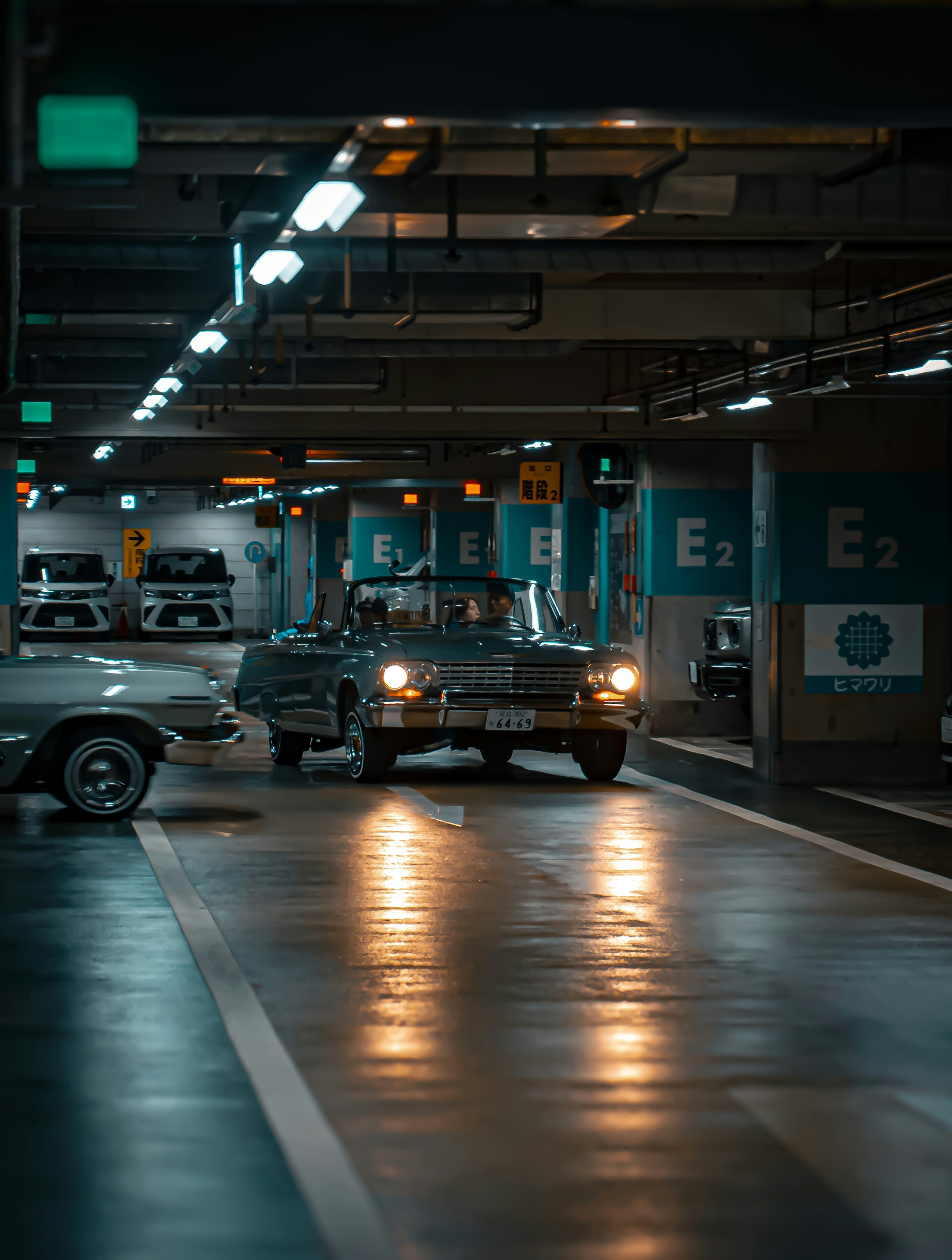 Midnight Convertible in a Neon-Washed Parking Garage