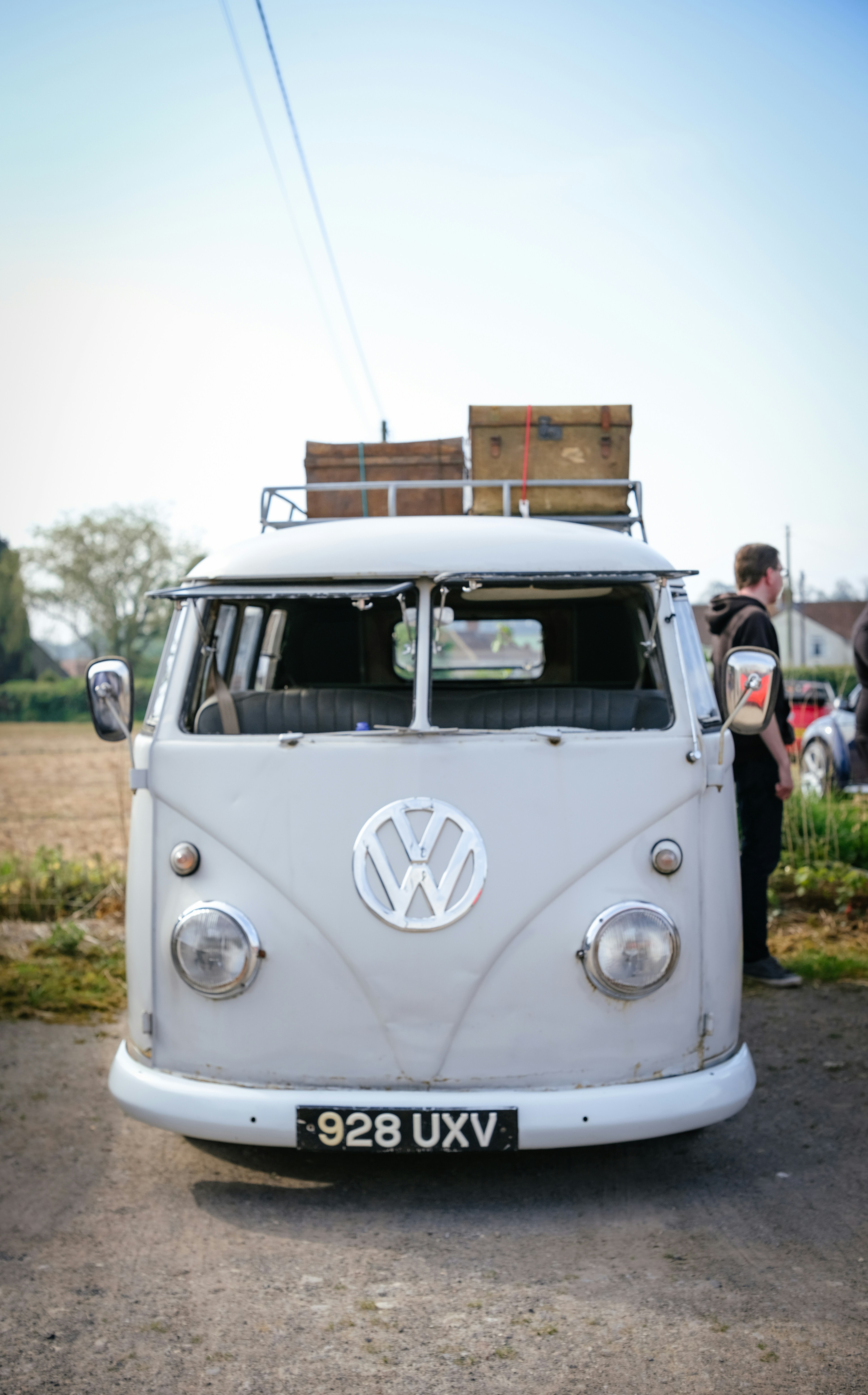 Luggage on the Roof: A Weathered VW Bus Ready for the Open Road