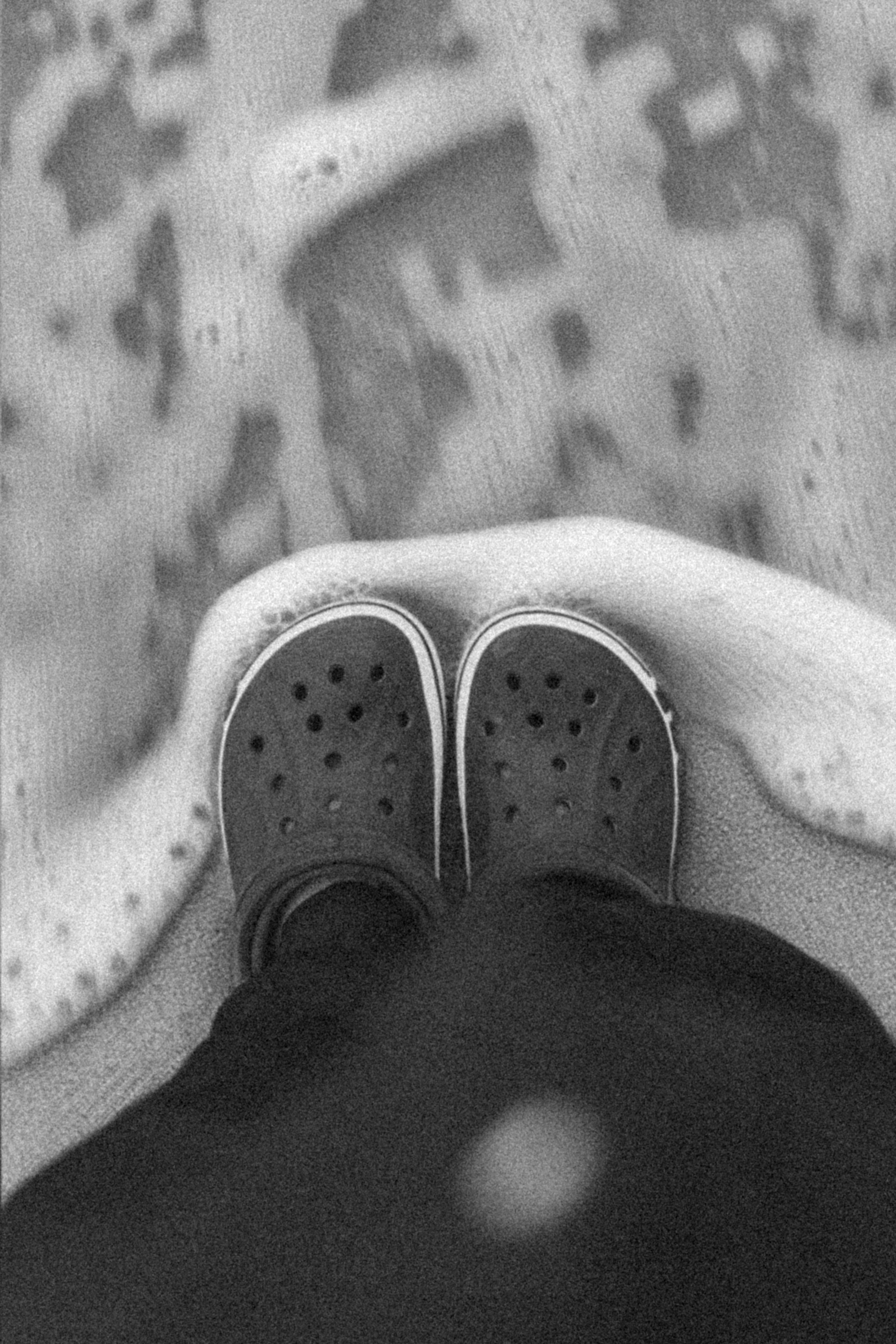 First Steps on Soft Waves: A Tiny Pair at the Edge of a Quiet Shower
