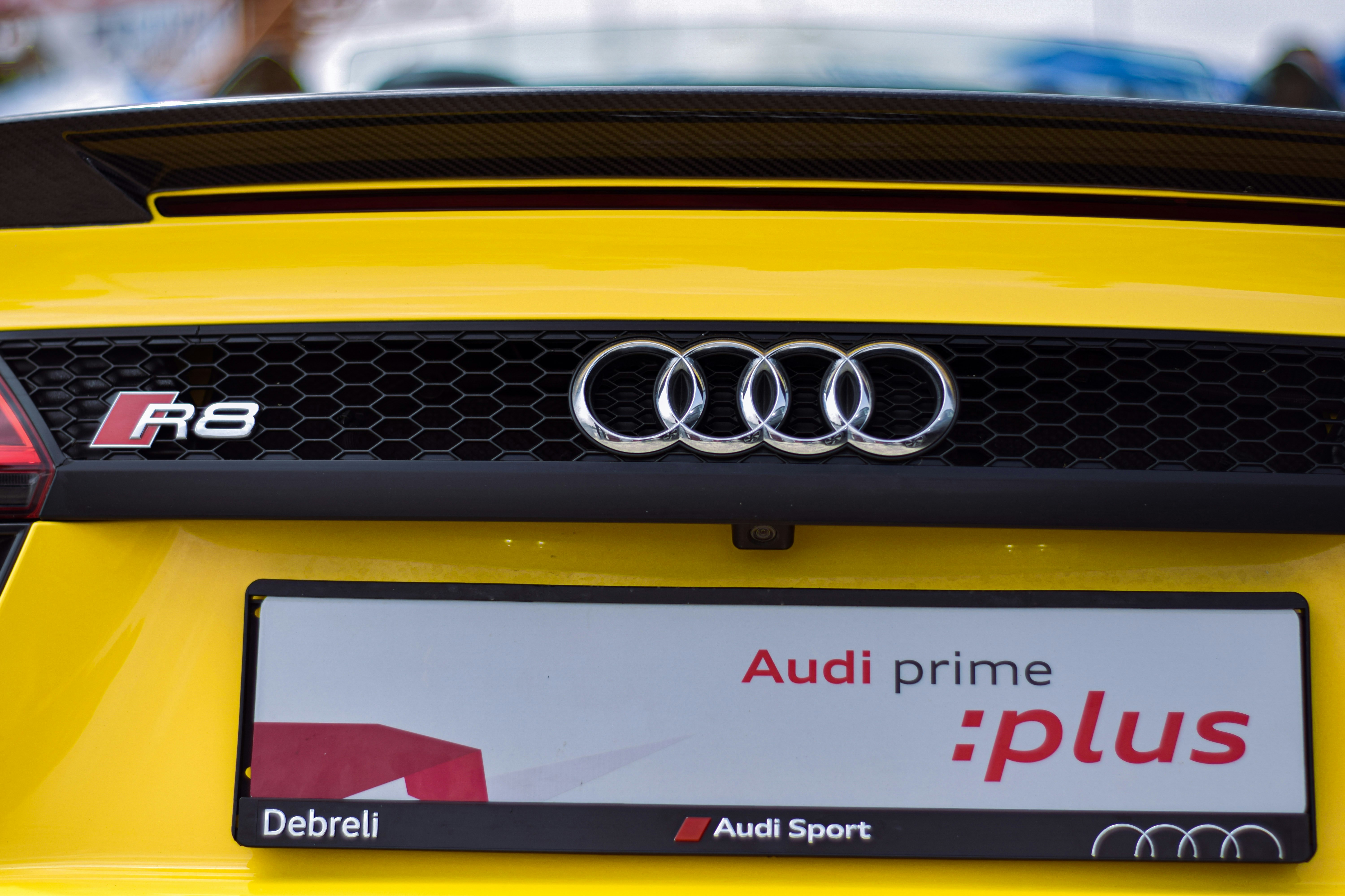 A close up of the rear of a yellow car photo – Free Car wallpaper Image ...