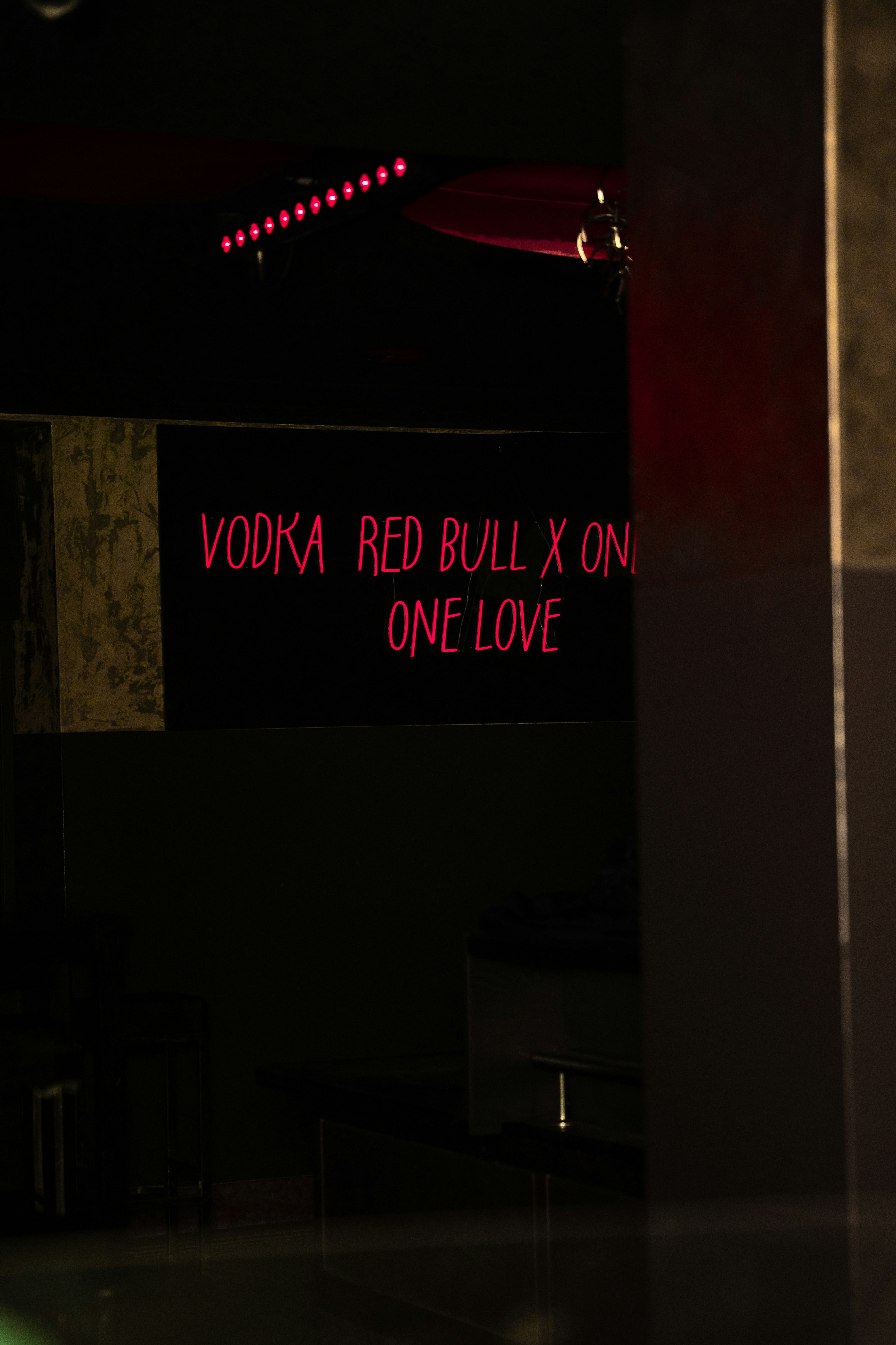 A neon sign that reads vodka red bull x on one love photo – Free Dark ...