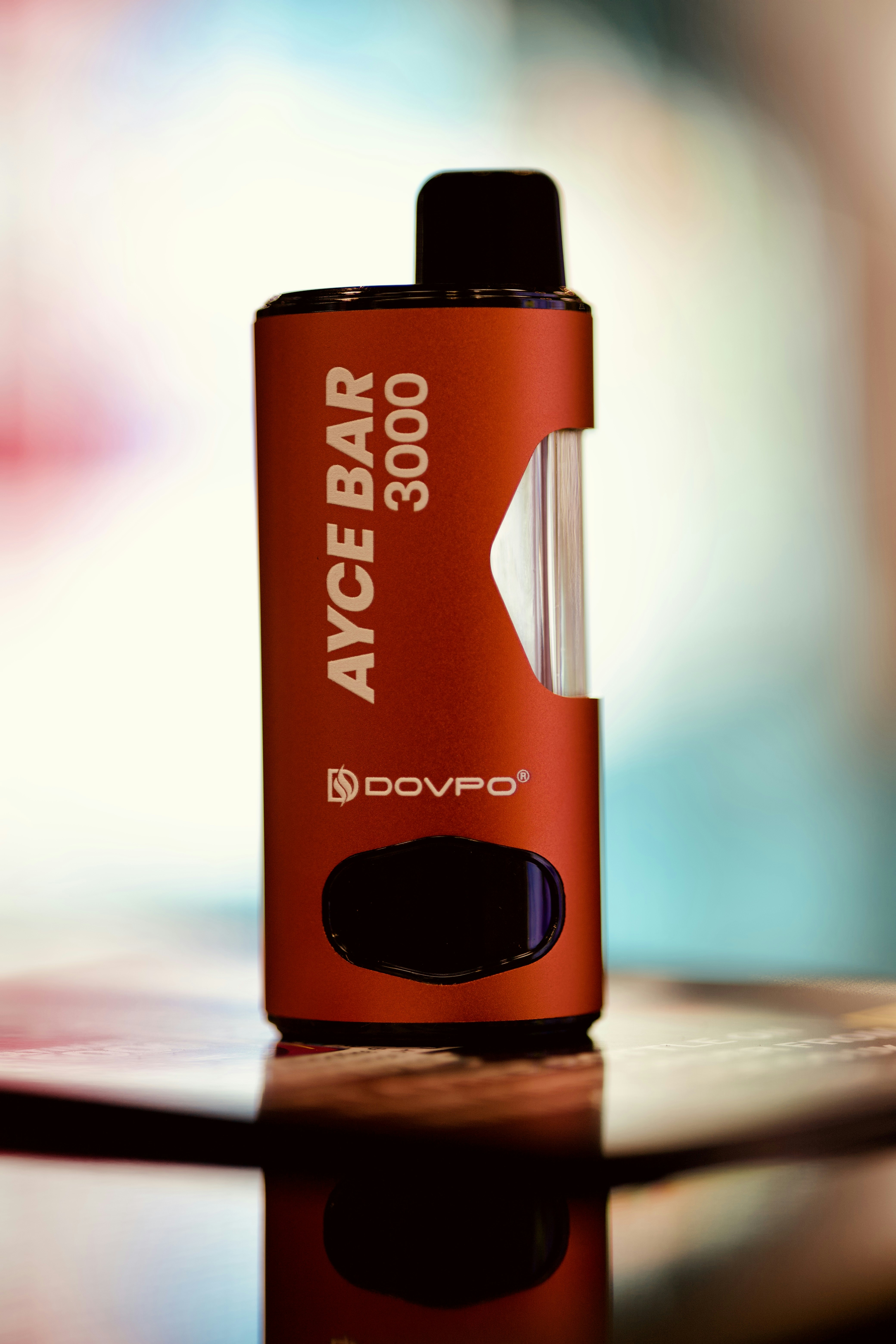 A red vape sitting on top of a wooden table photo – Free Nec Image on ...
