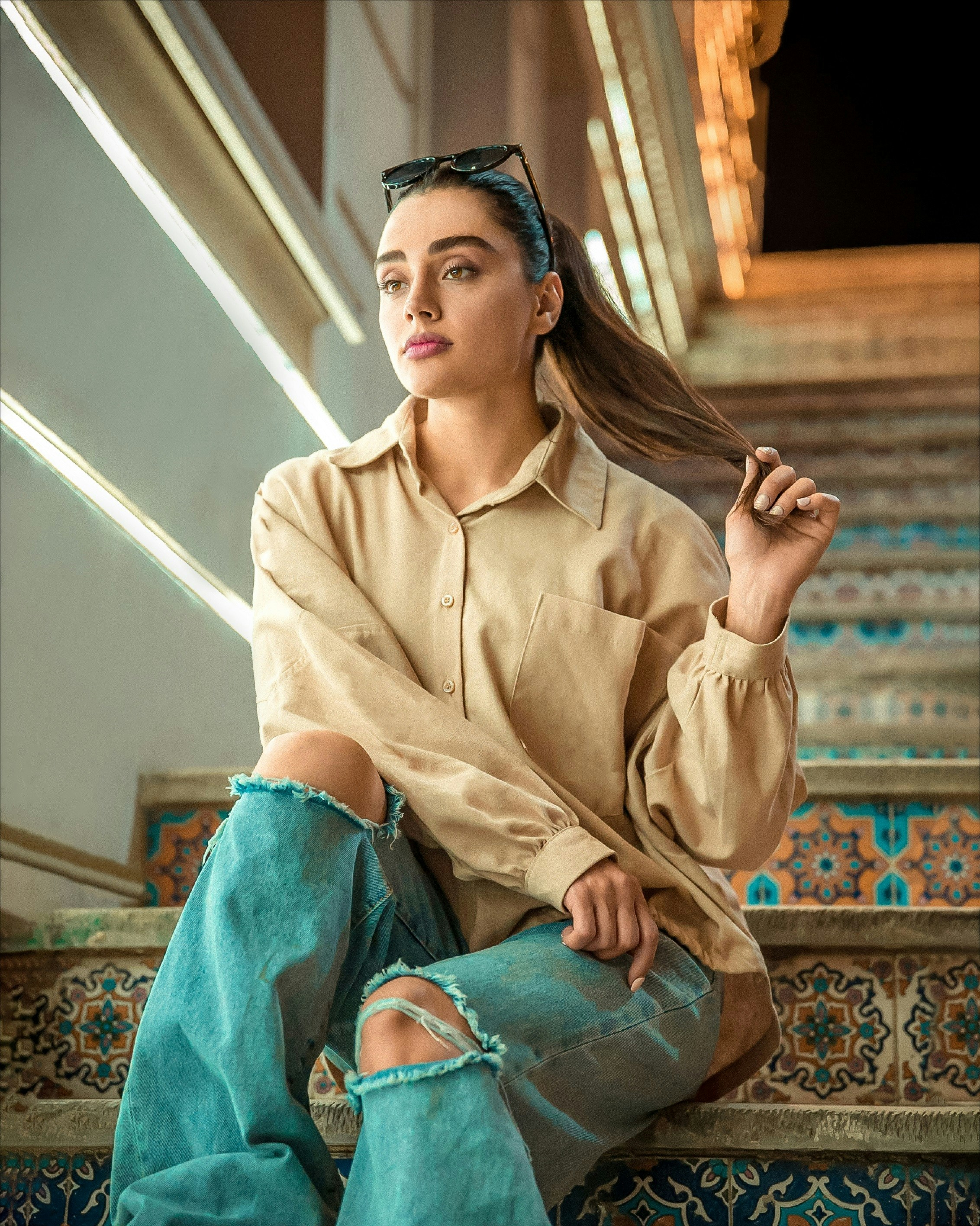 Neon Lines and Quiet Confidence: Portrait on a Patterned Staircase