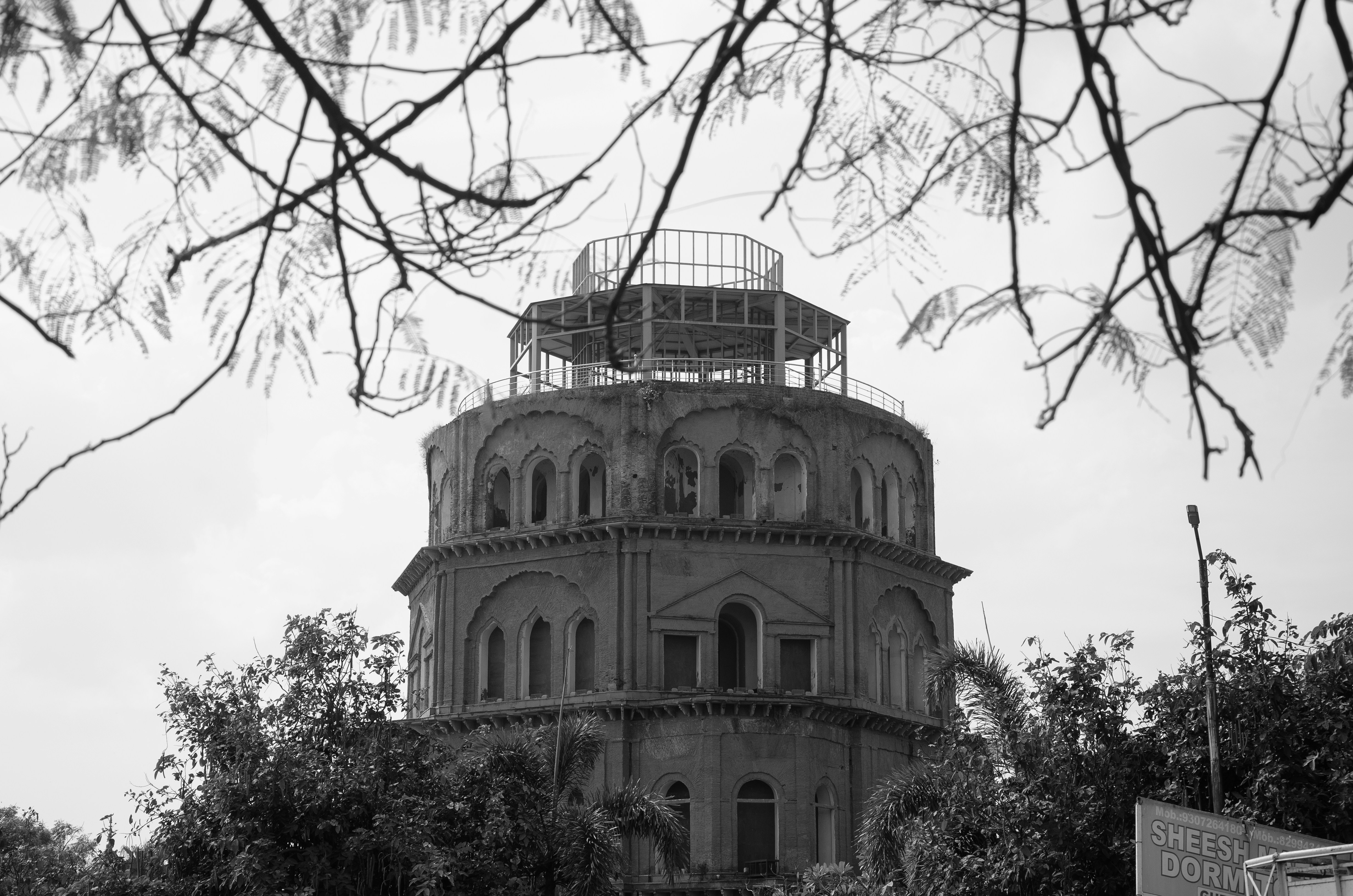 A tower with a bird cage on top of it photo – Free Satkhanda Image on ...
