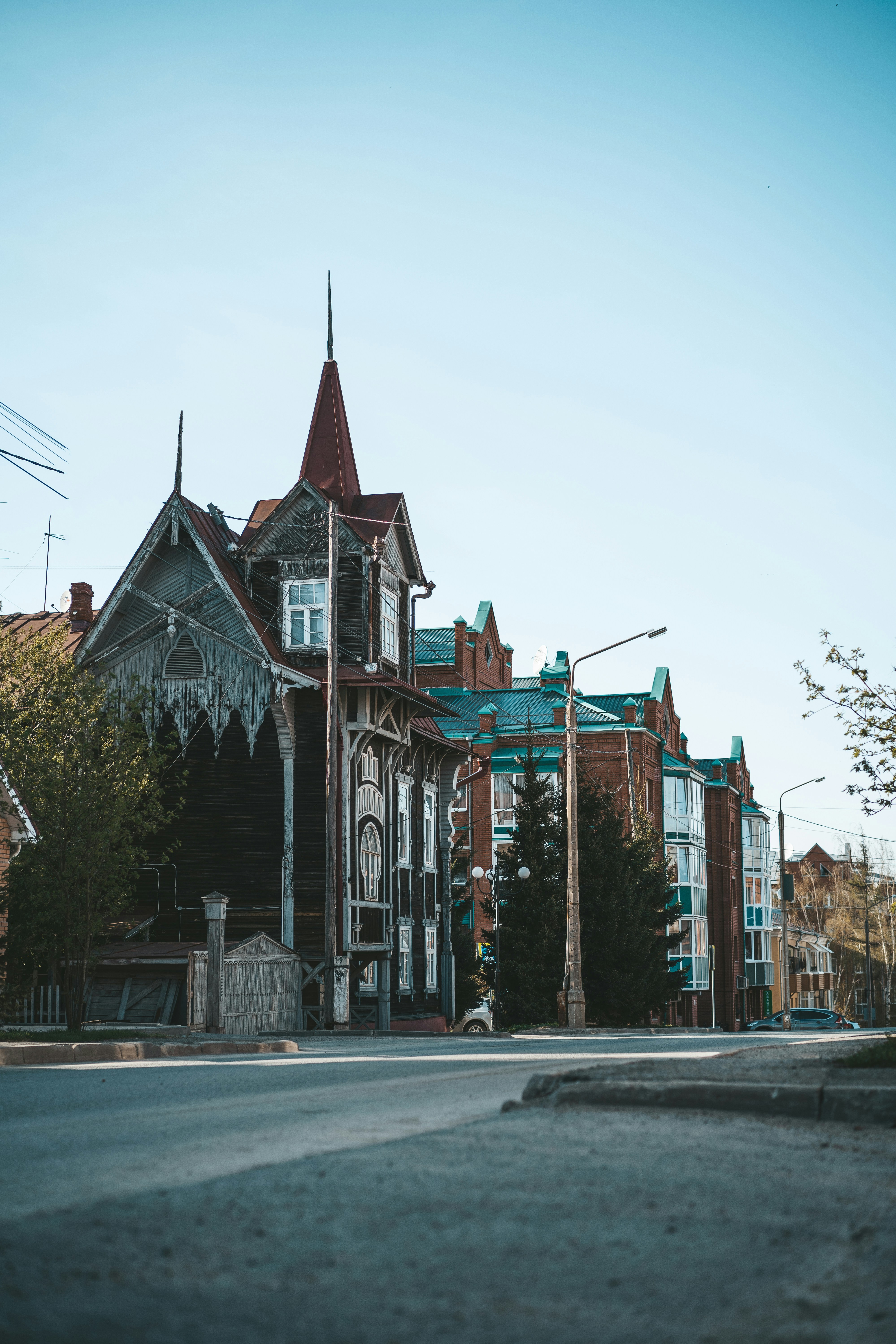 Old Town Facade: Weathered Victorian Spire Against a Clear Sky