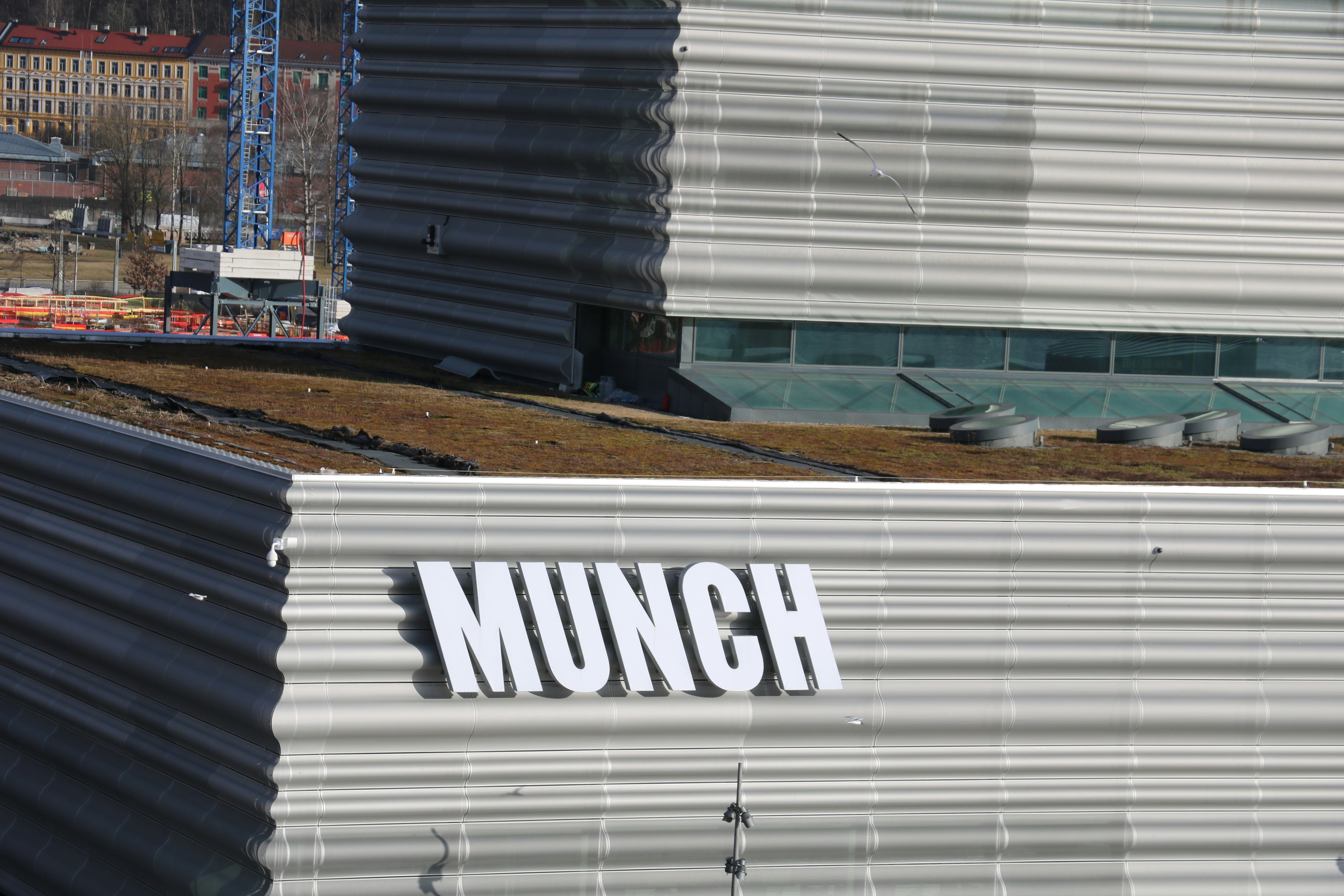 The word munch written on the side of a building photo – Free ...