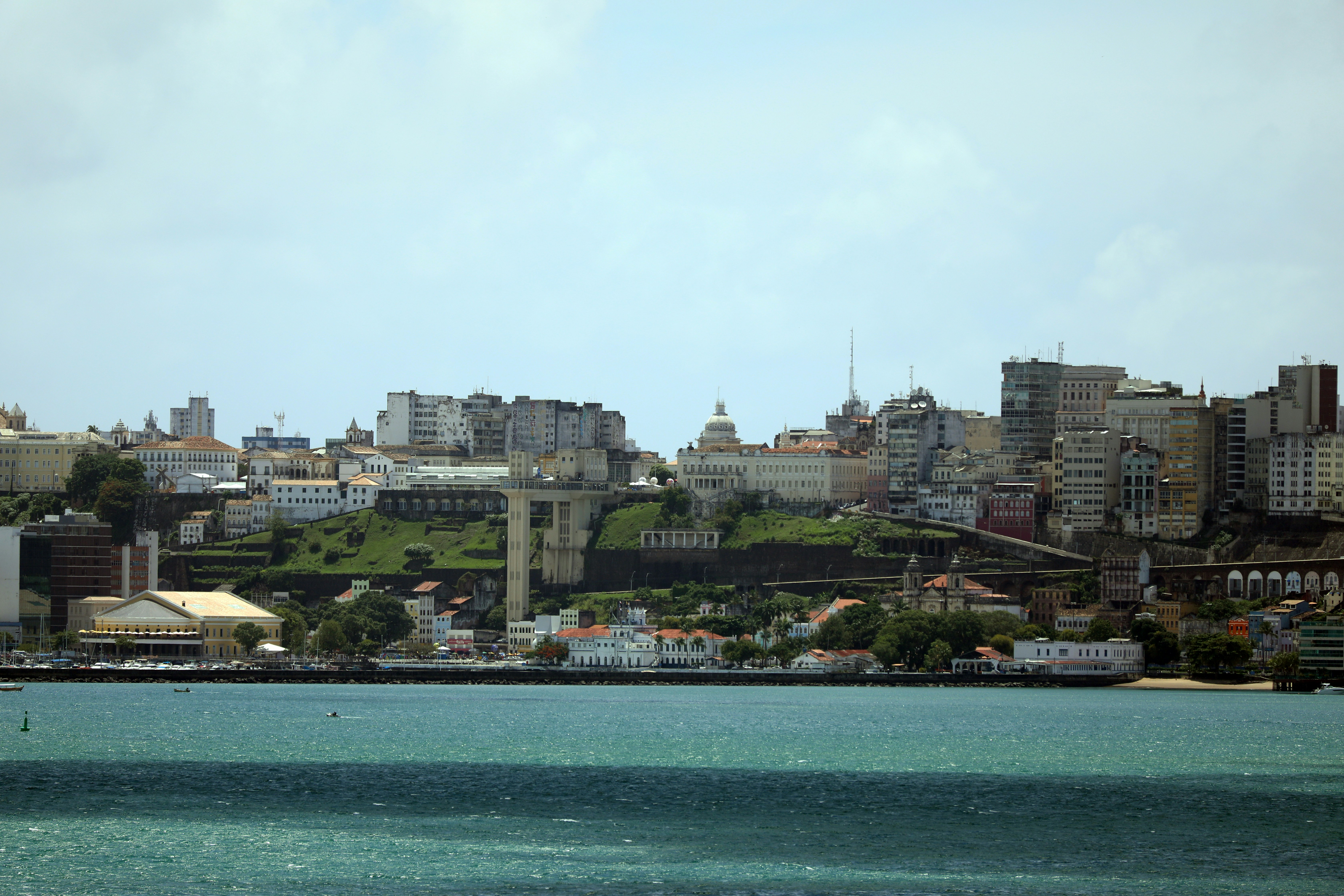 Coastal city skyline with diverse architecture along the waterfront.