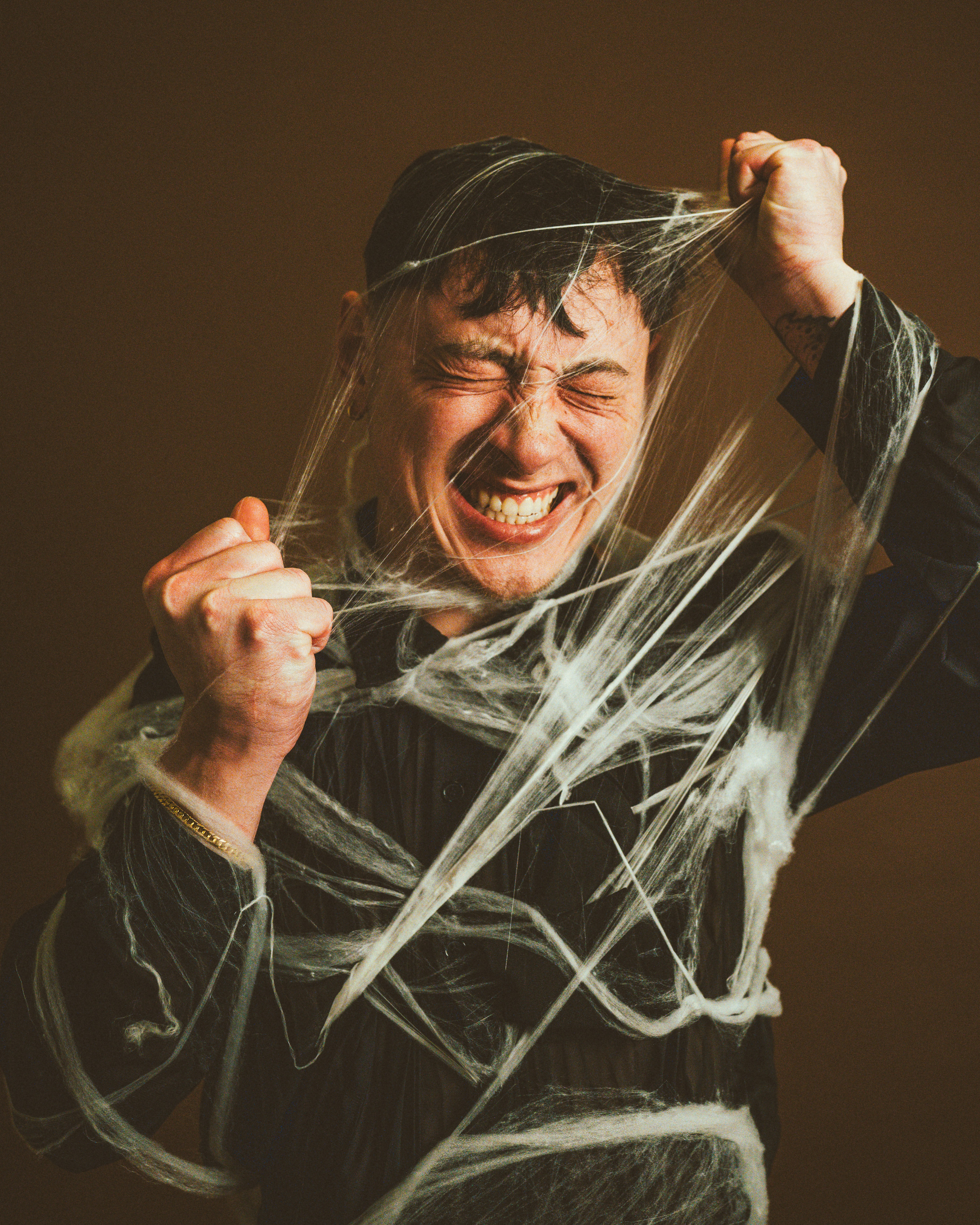 A man holding a string wrapped around his head photo – Free Portrait ...