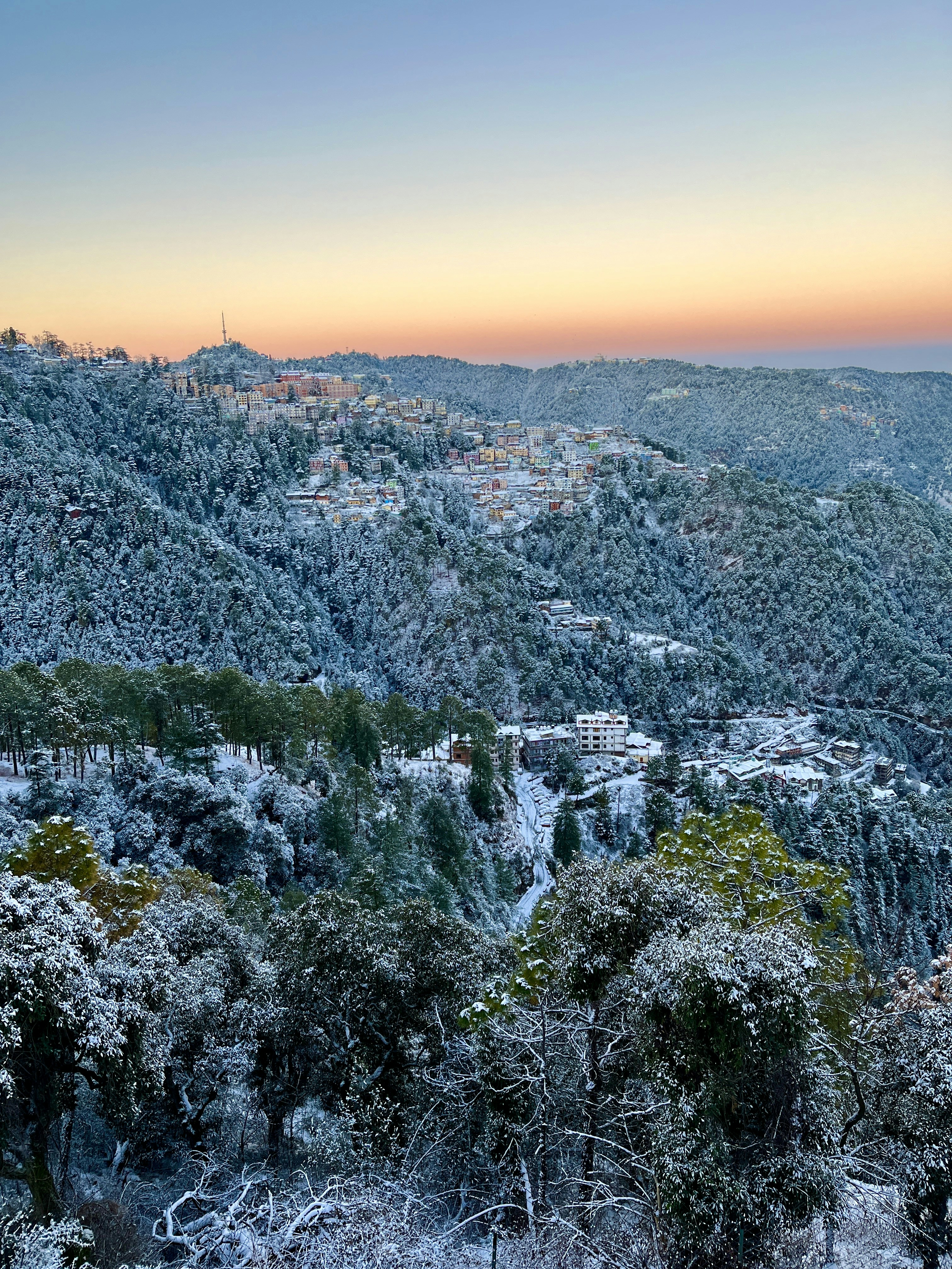 A view of a city in the distance covered in snow photo – Free Shimla ...