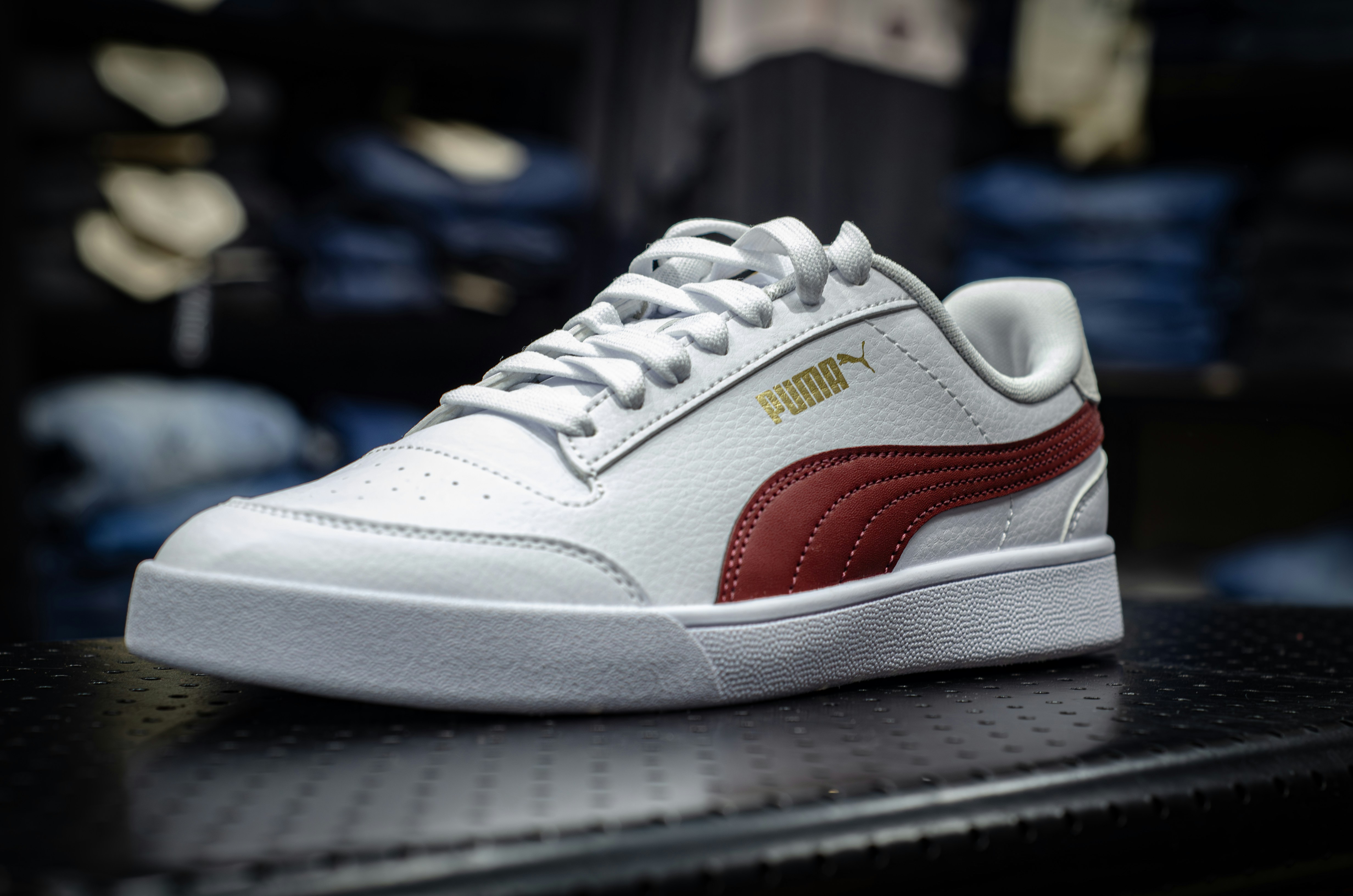 A white and red sneaker on a table photo – Free Shoe Image on Unsplash