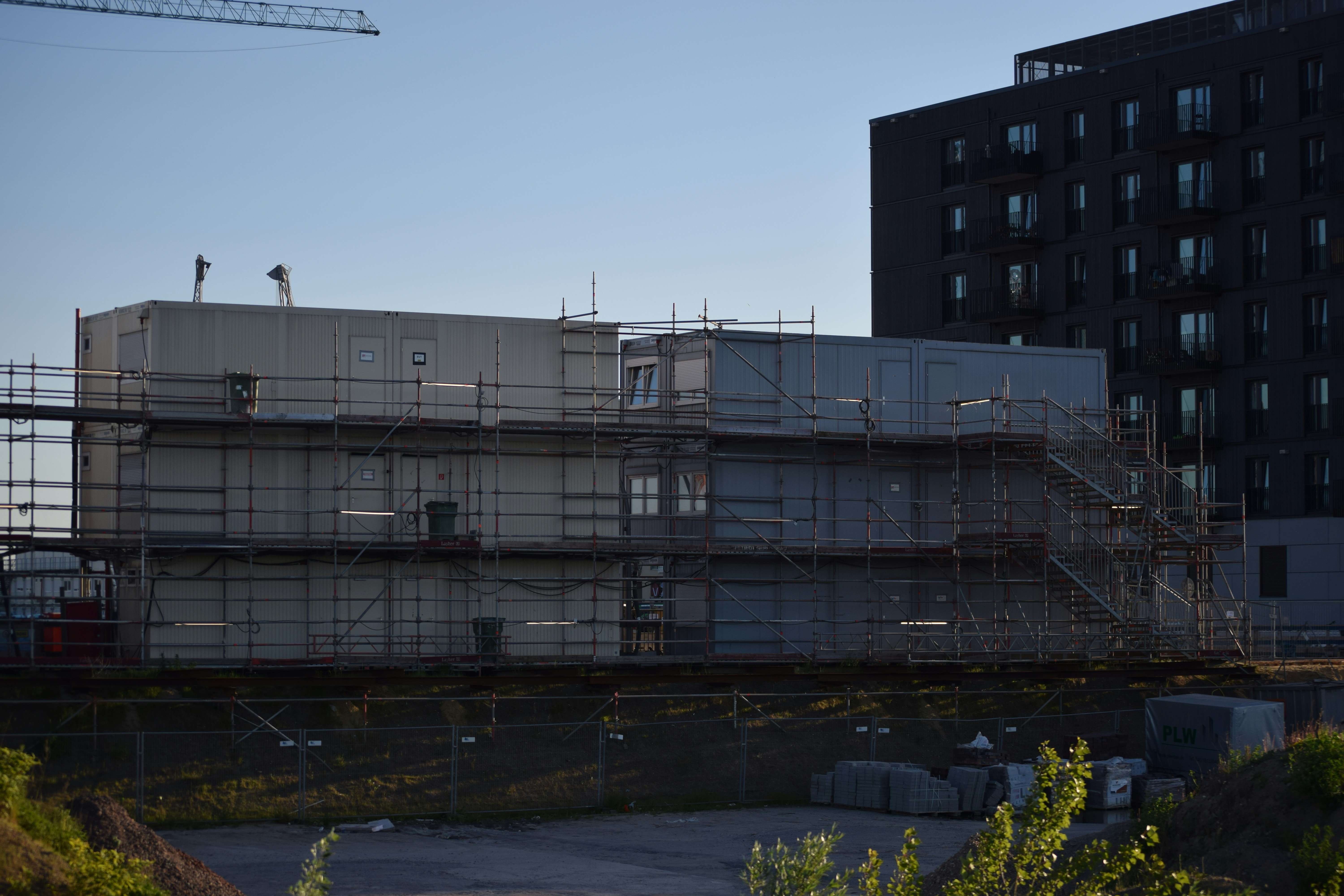 A large building with scaffolding on the side of it photo – Free ...