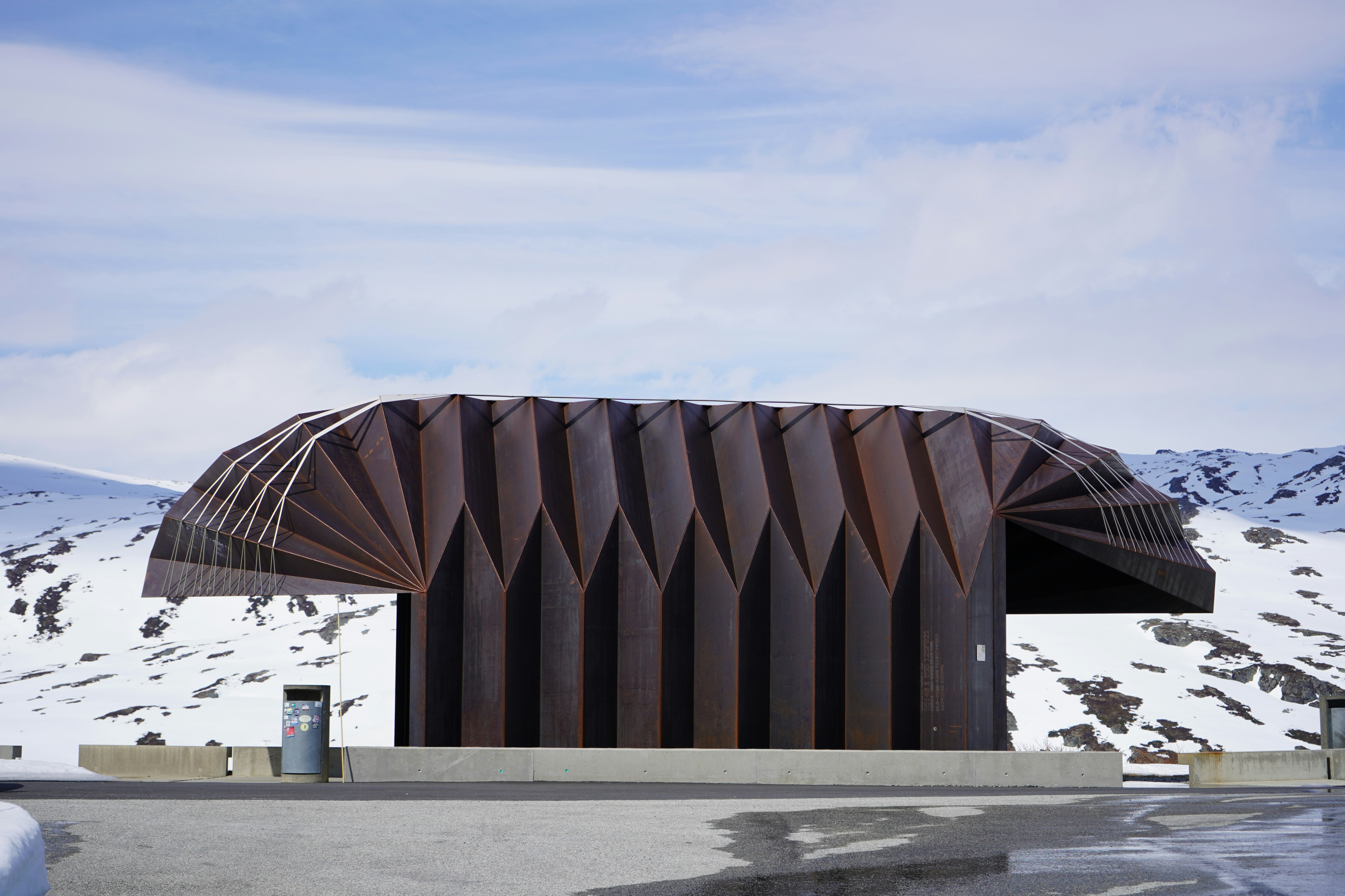 Architectural structure with a unique, angular design set against a snowy landscape.