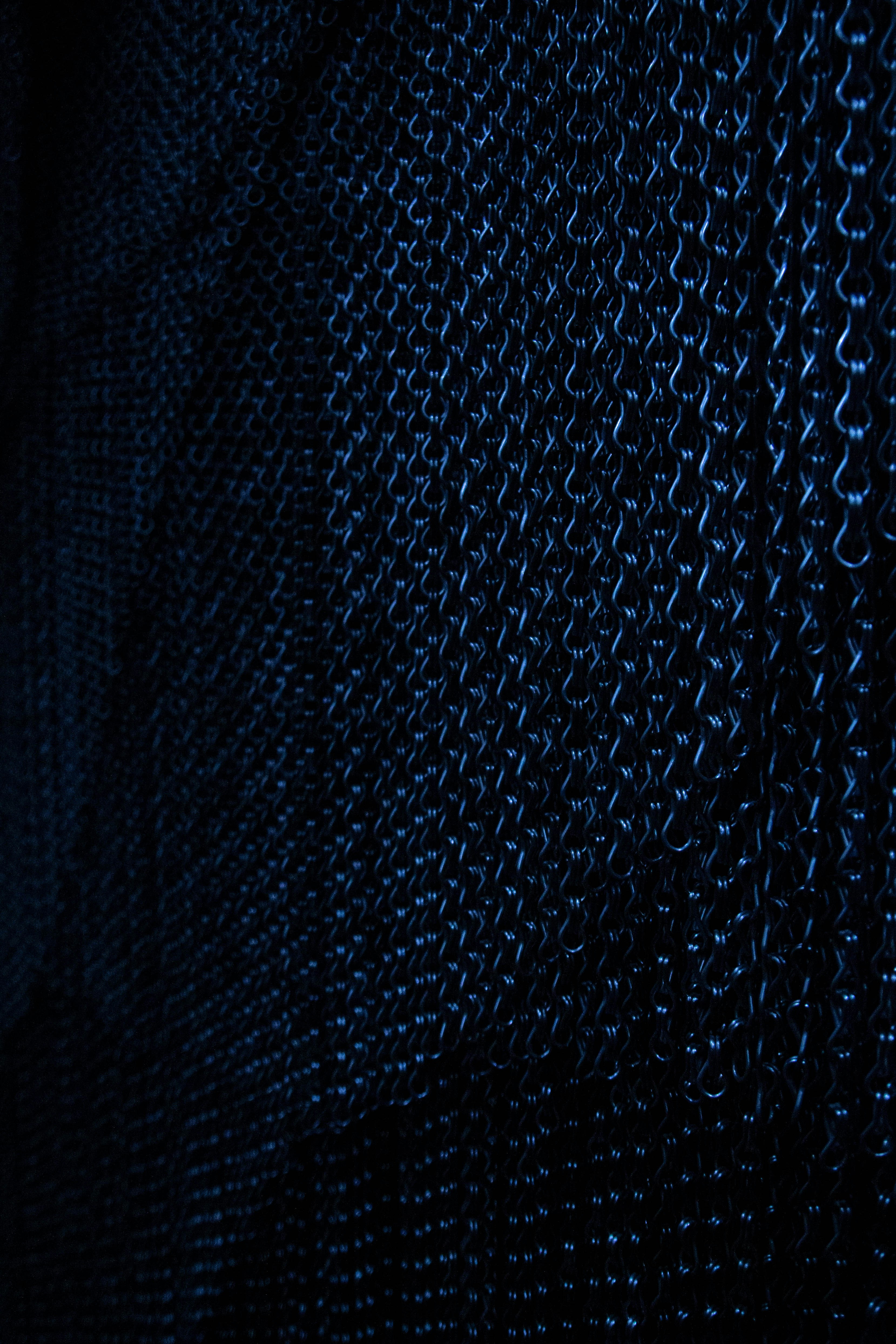 A close up of a cell phone with a dark background photo – Free ...