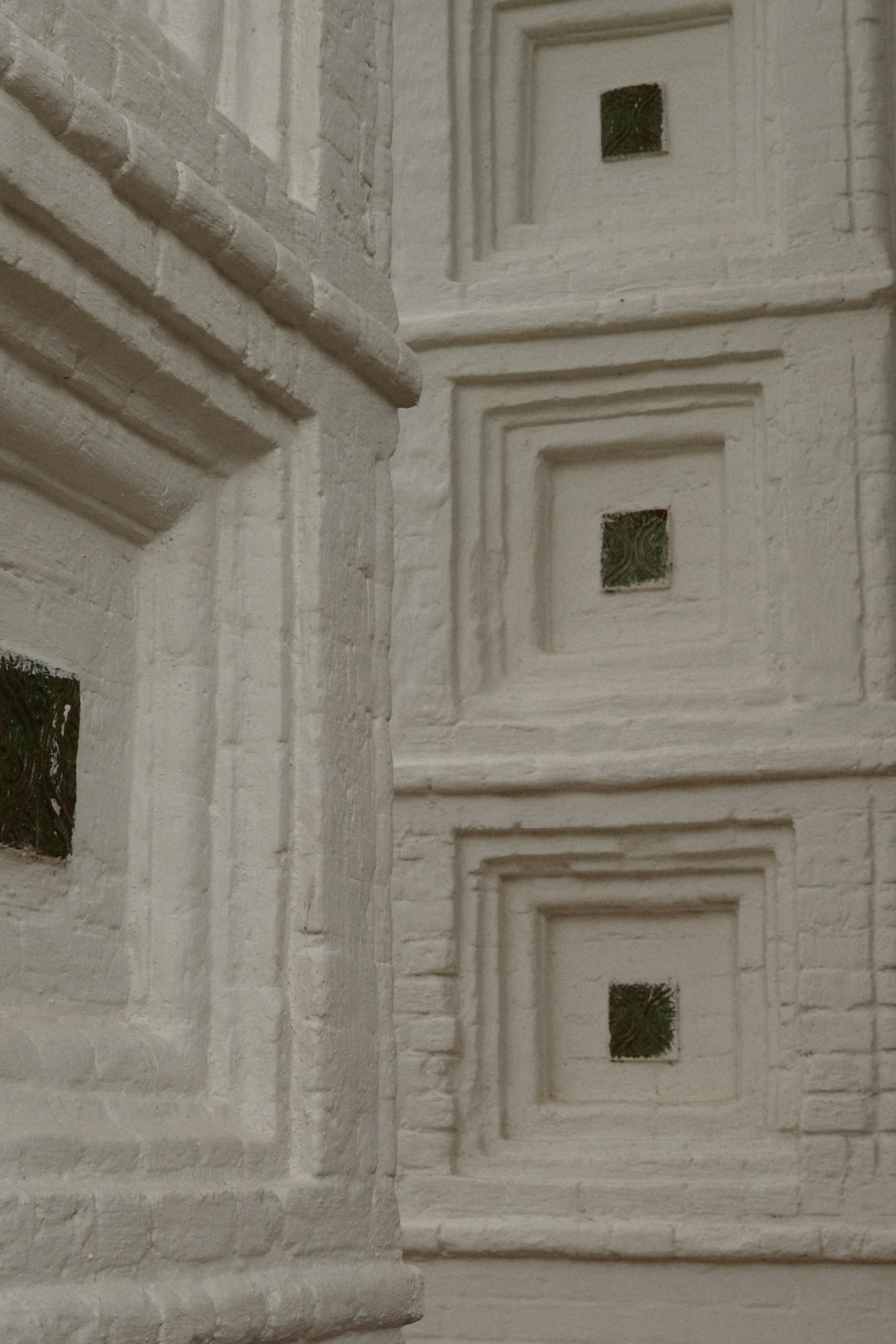 a close up of a wall with a clock on it