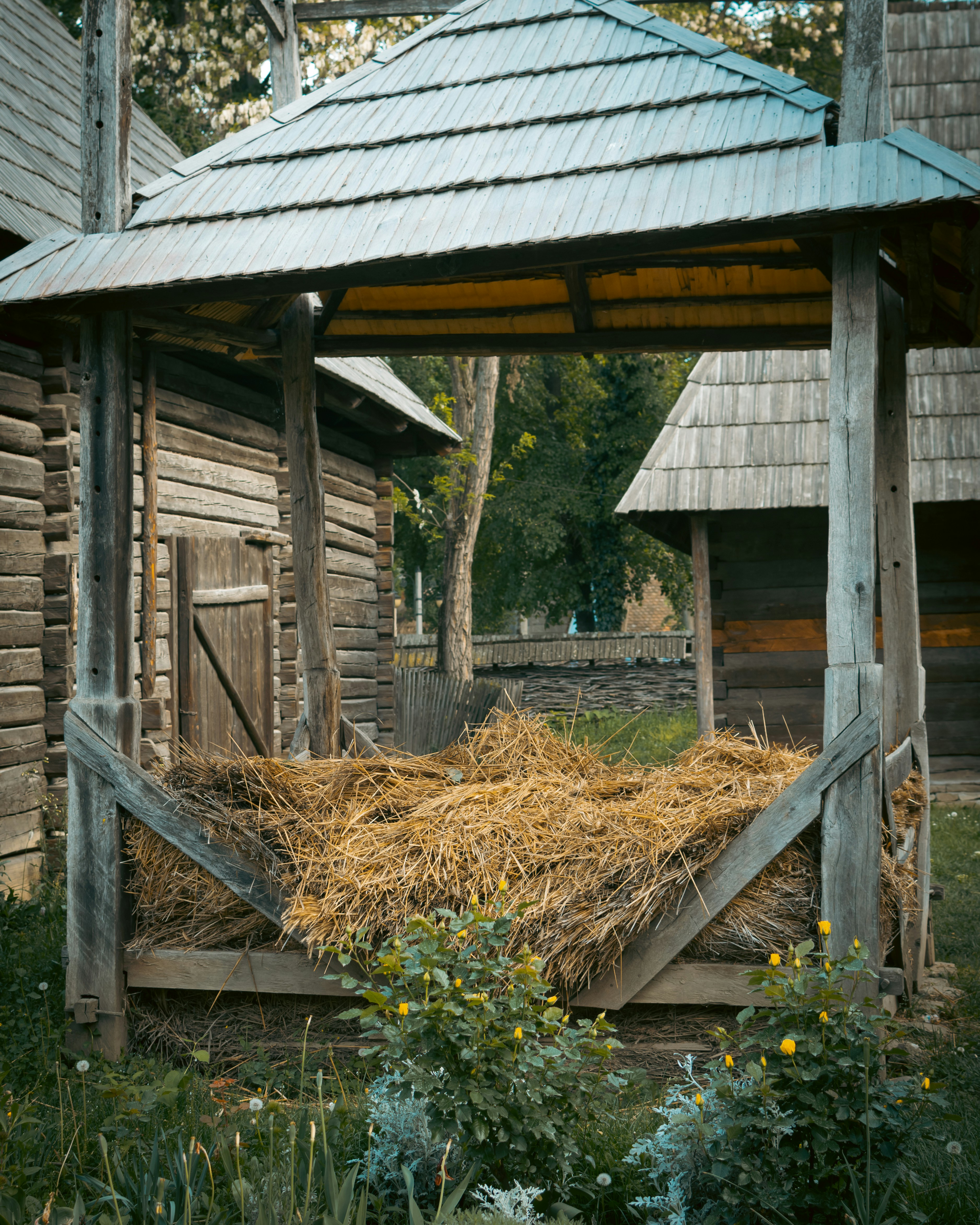 Haystack in a Timber Courtyard: Weathered Wood and Quiet Light