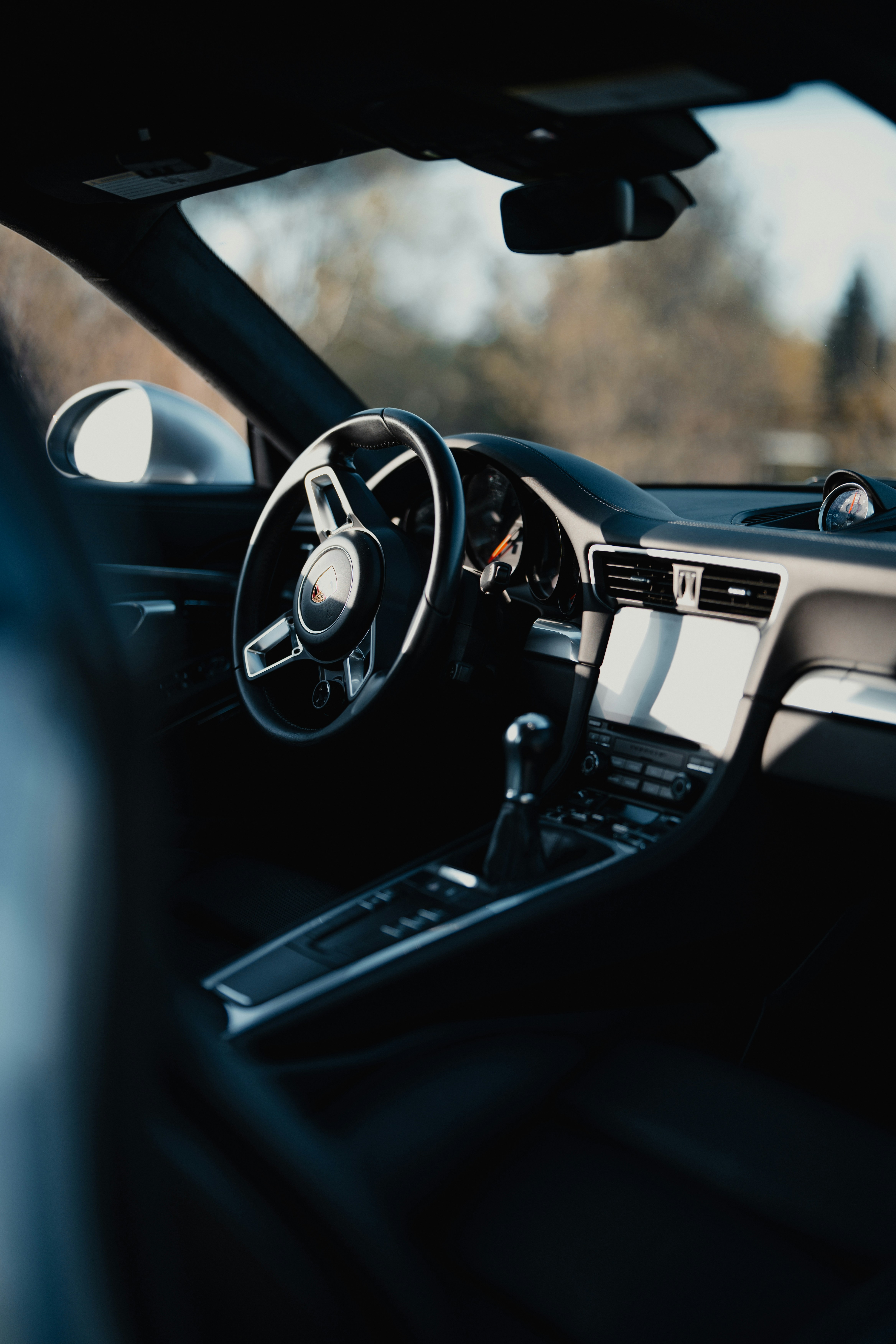 The interior of a car with a steering wheel and dashboard photo – Free ...