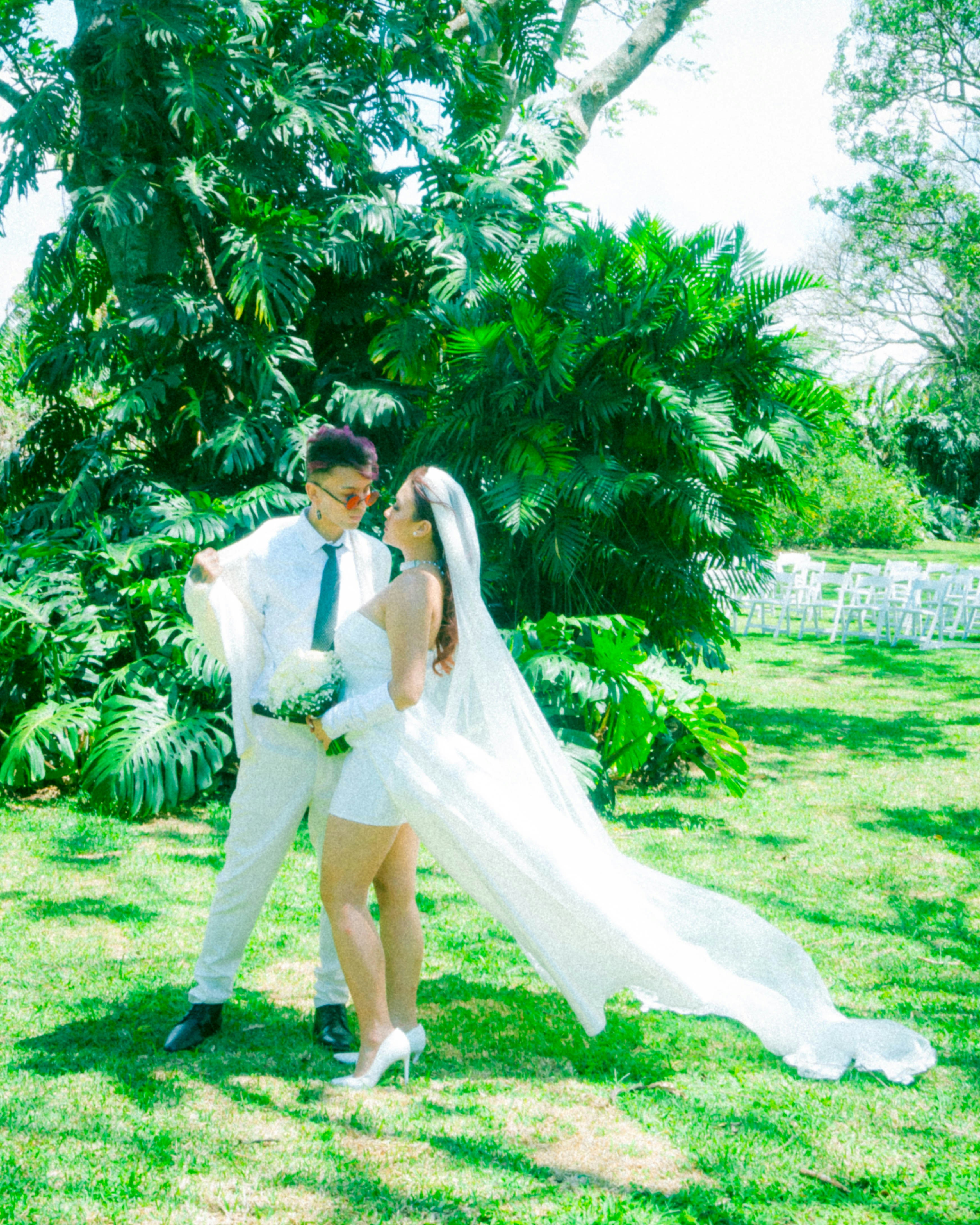 A bride and groom standing in the grass photo – Free Bride and groom ...