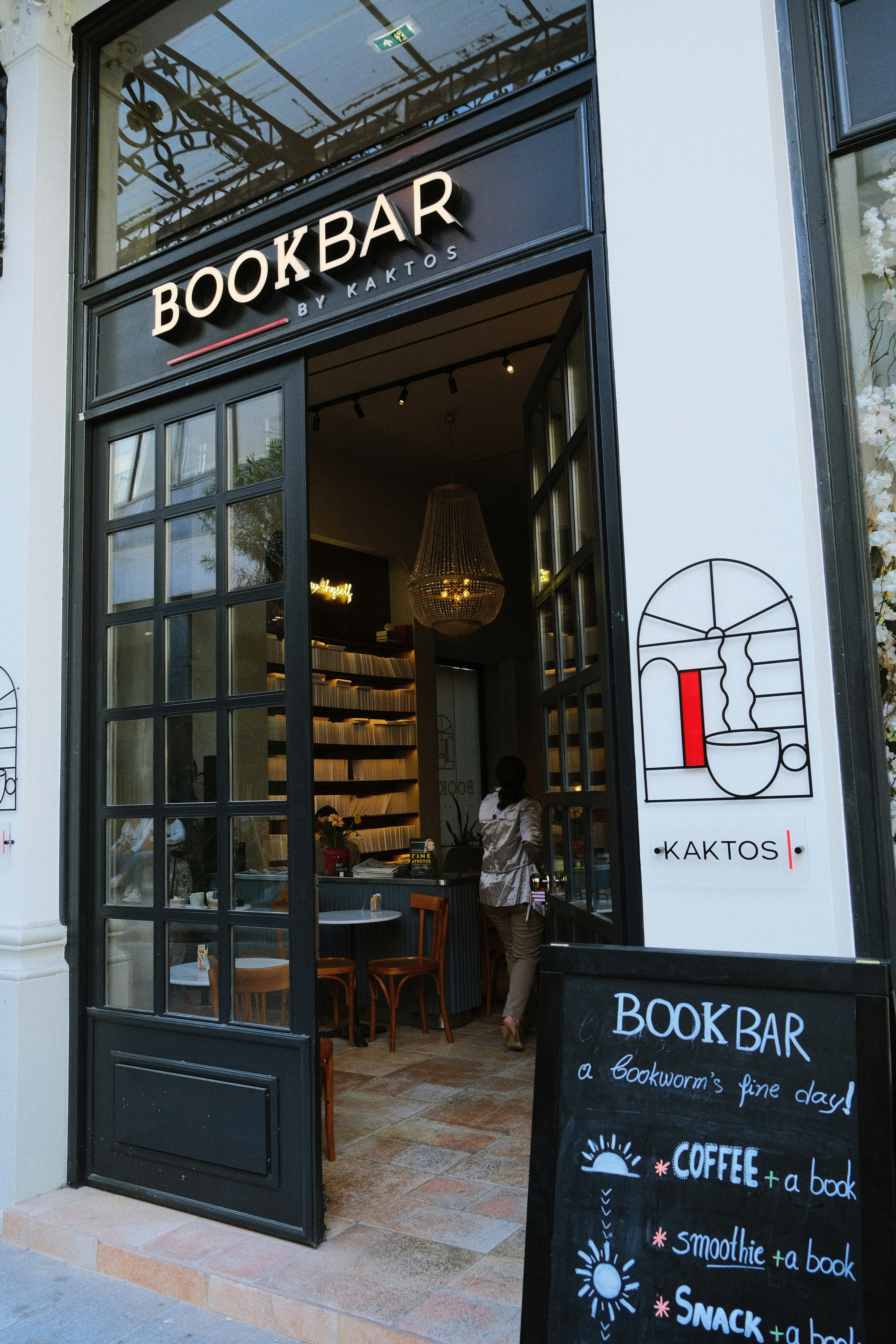 A man is entering a book bar with a menu photo – Free Athens Image on ...