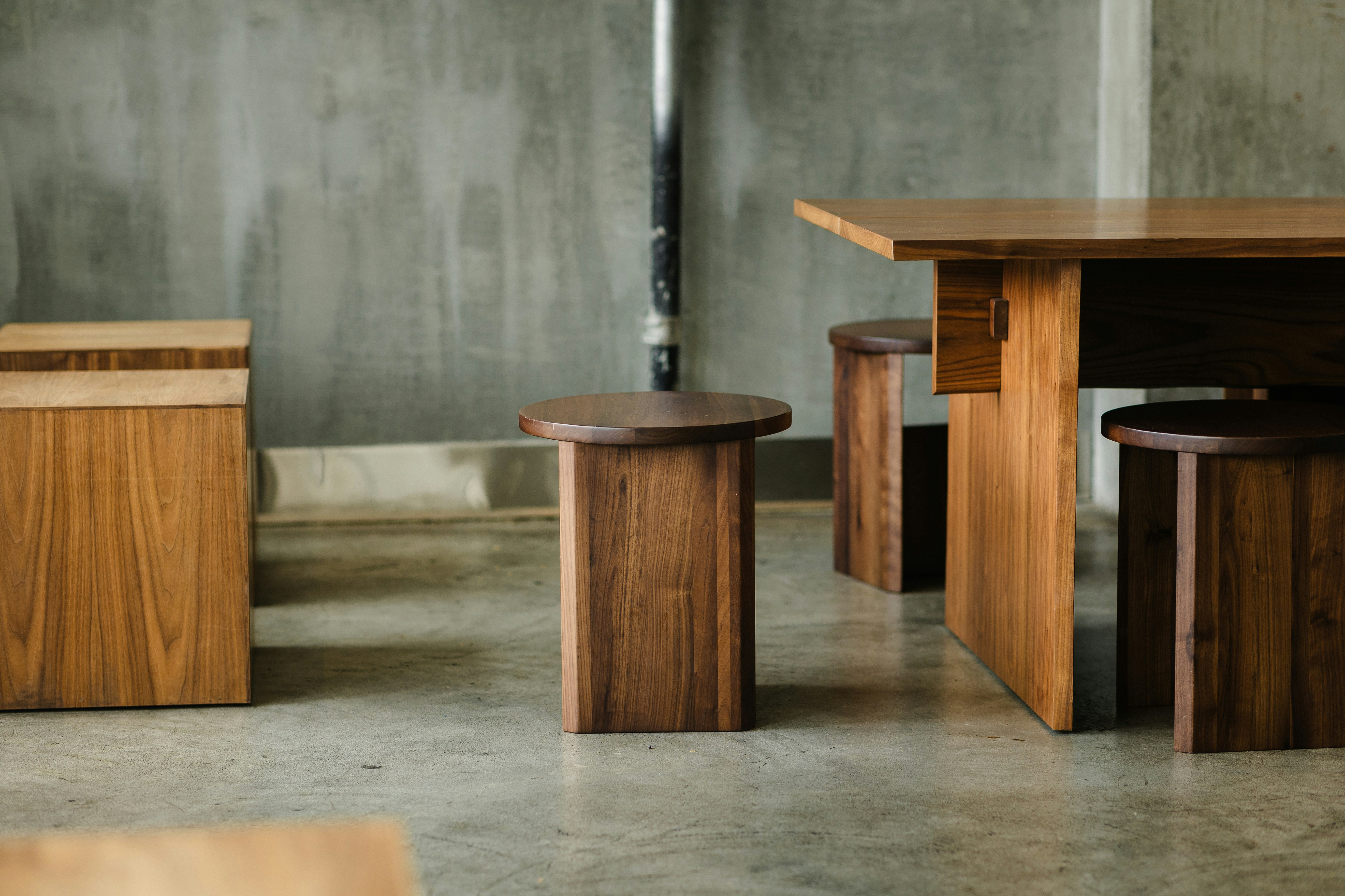 A group of wooden tables and stools in a room photo – Free Interior ...