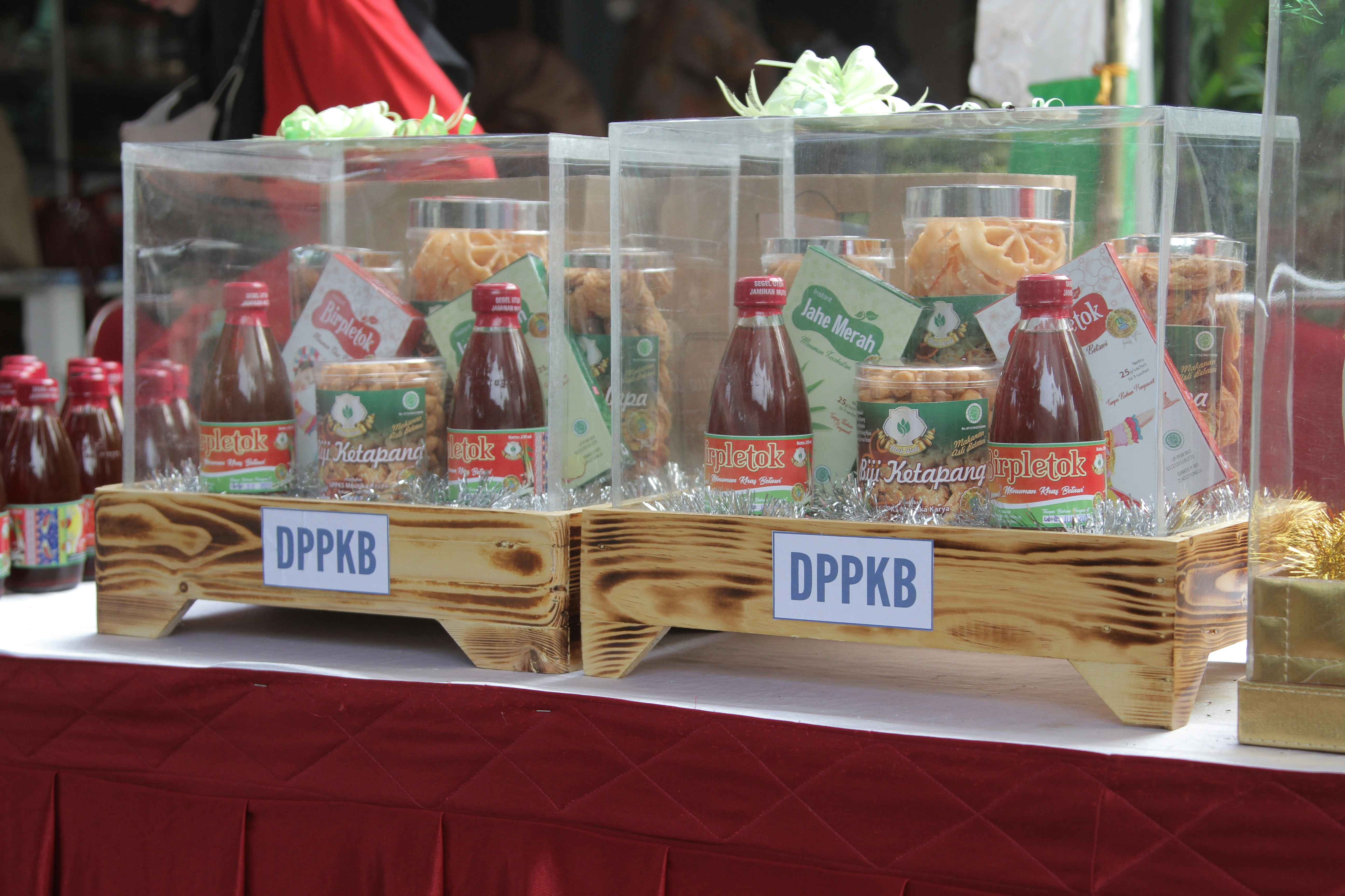 A display of bottled beverages on a table photo – Free Food Image on ...