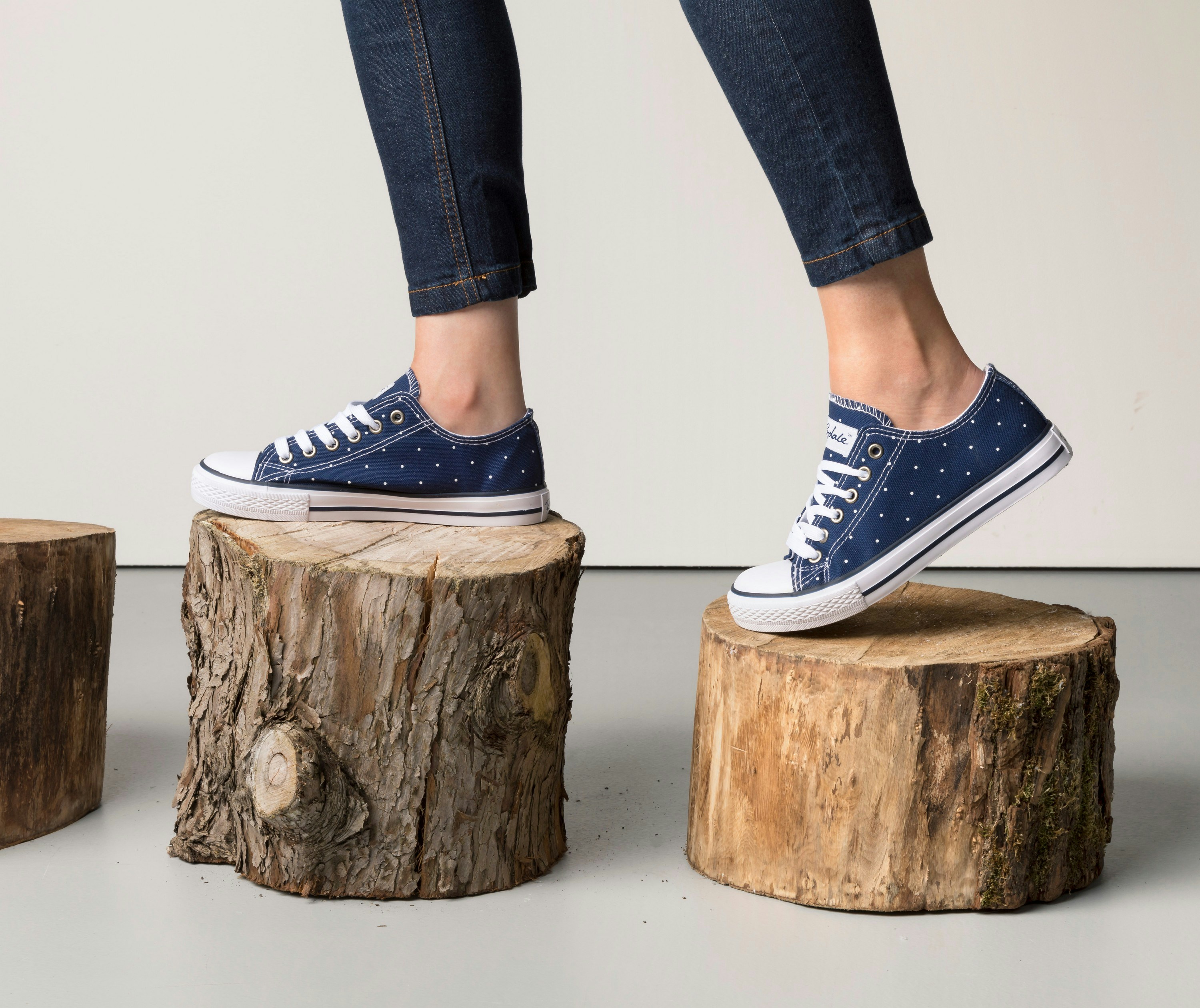 A person standing on top of a tree stump photo – Free Canvas trainers ...