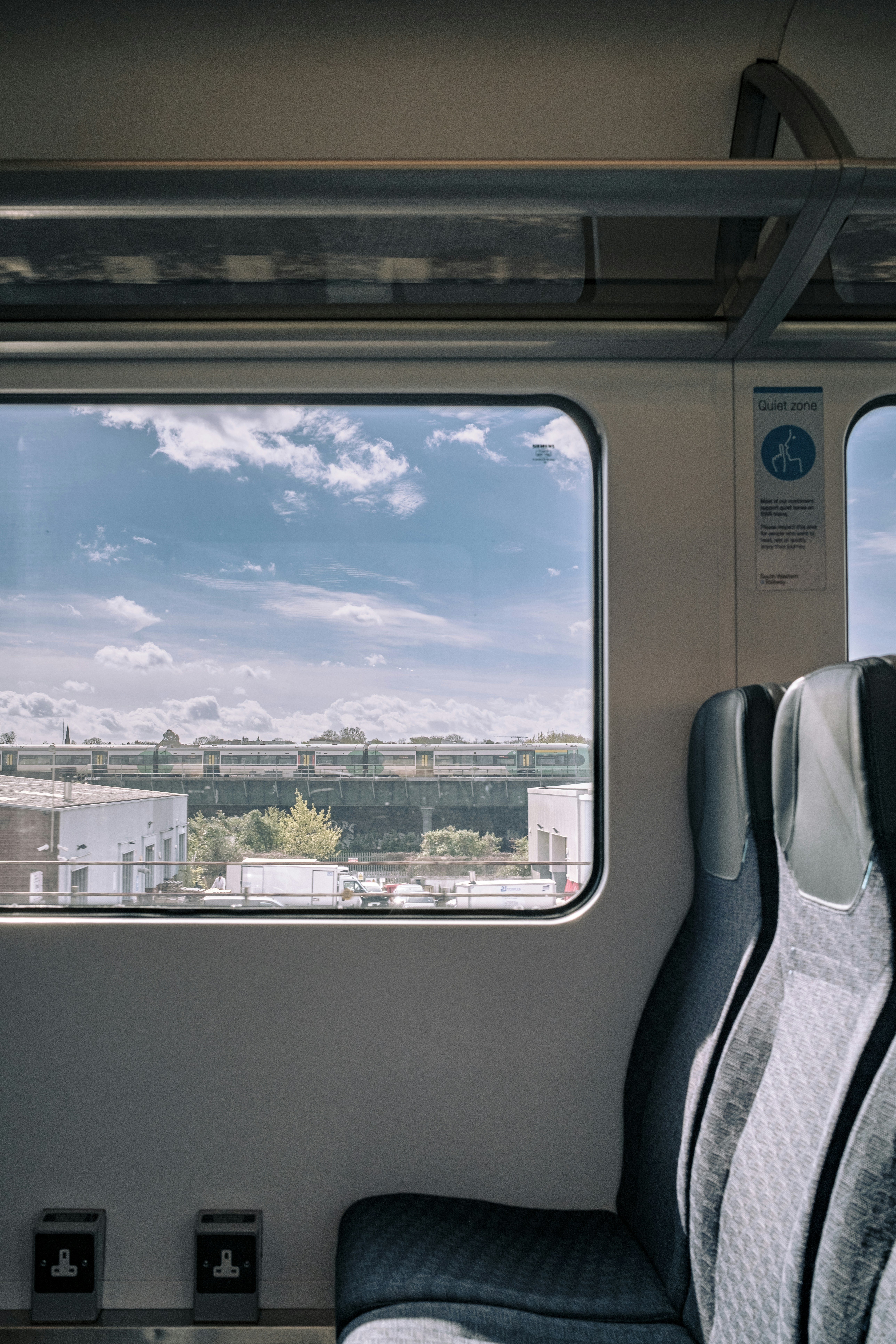 A view of a city from inside a train photo – Free Uk Image on Unsplash
