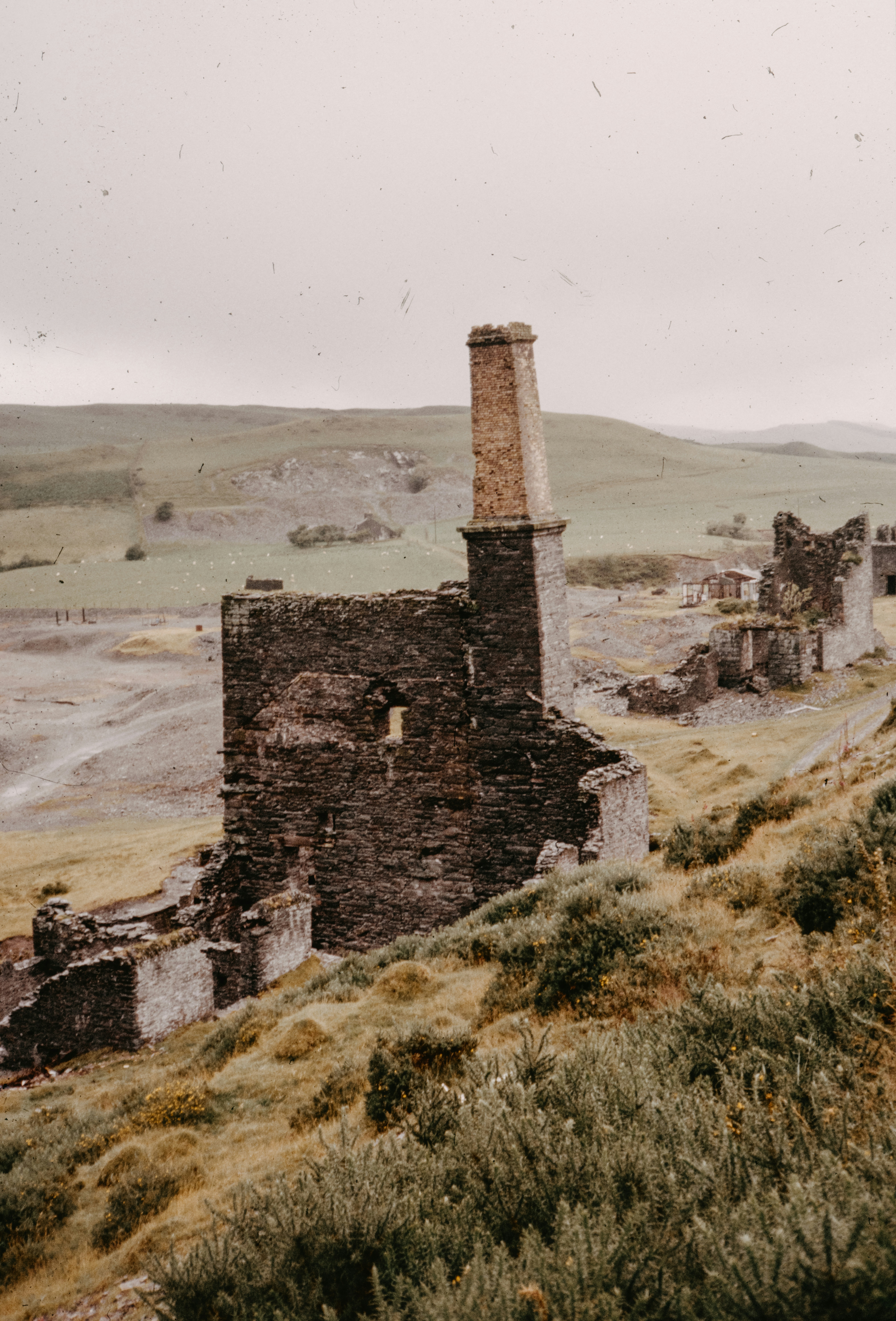 An old brick building sitting on top of a hill photo – Free Uk Image on ...