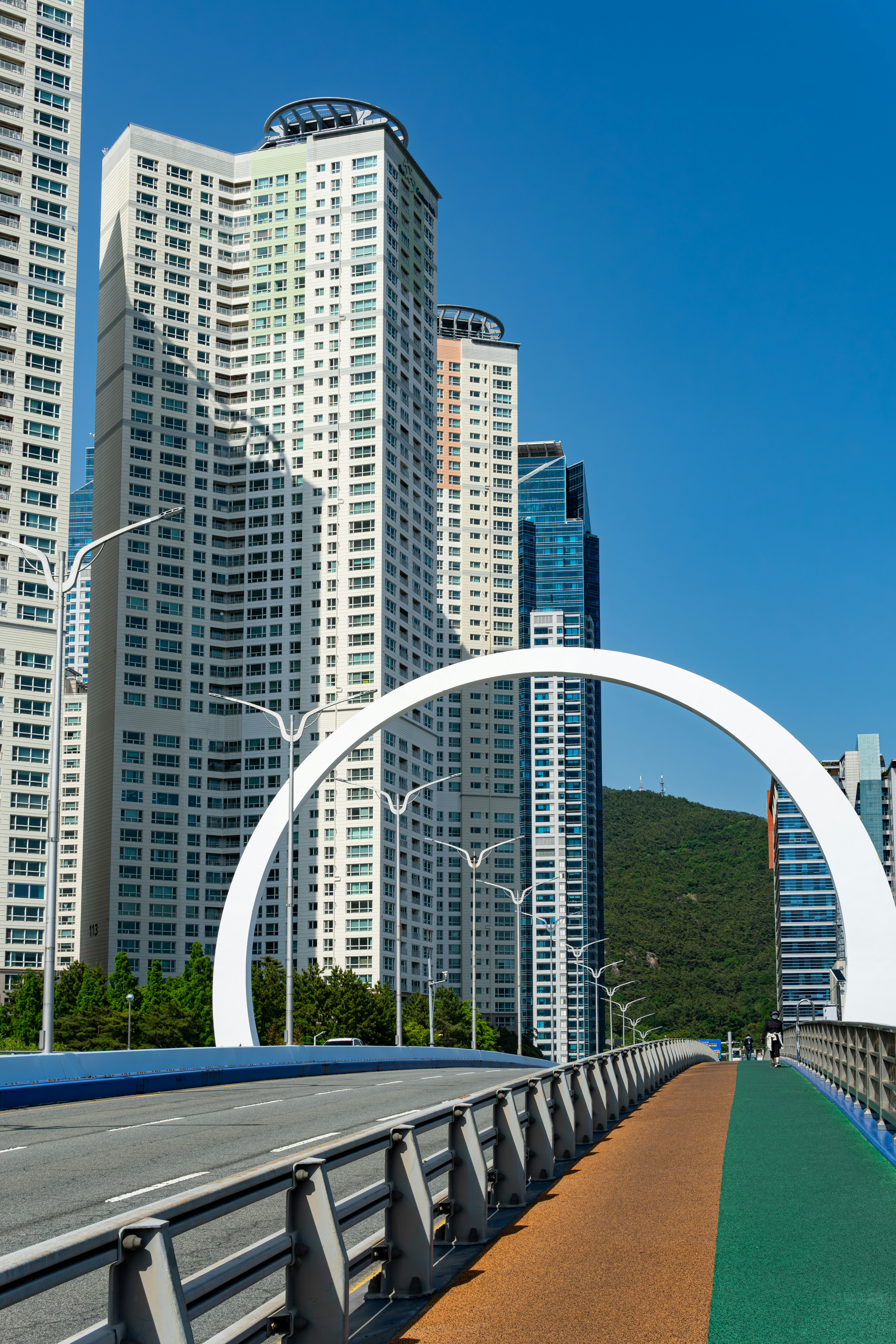 A white arch over a road in front of tall buildings photo – Free 대한민국 ...
