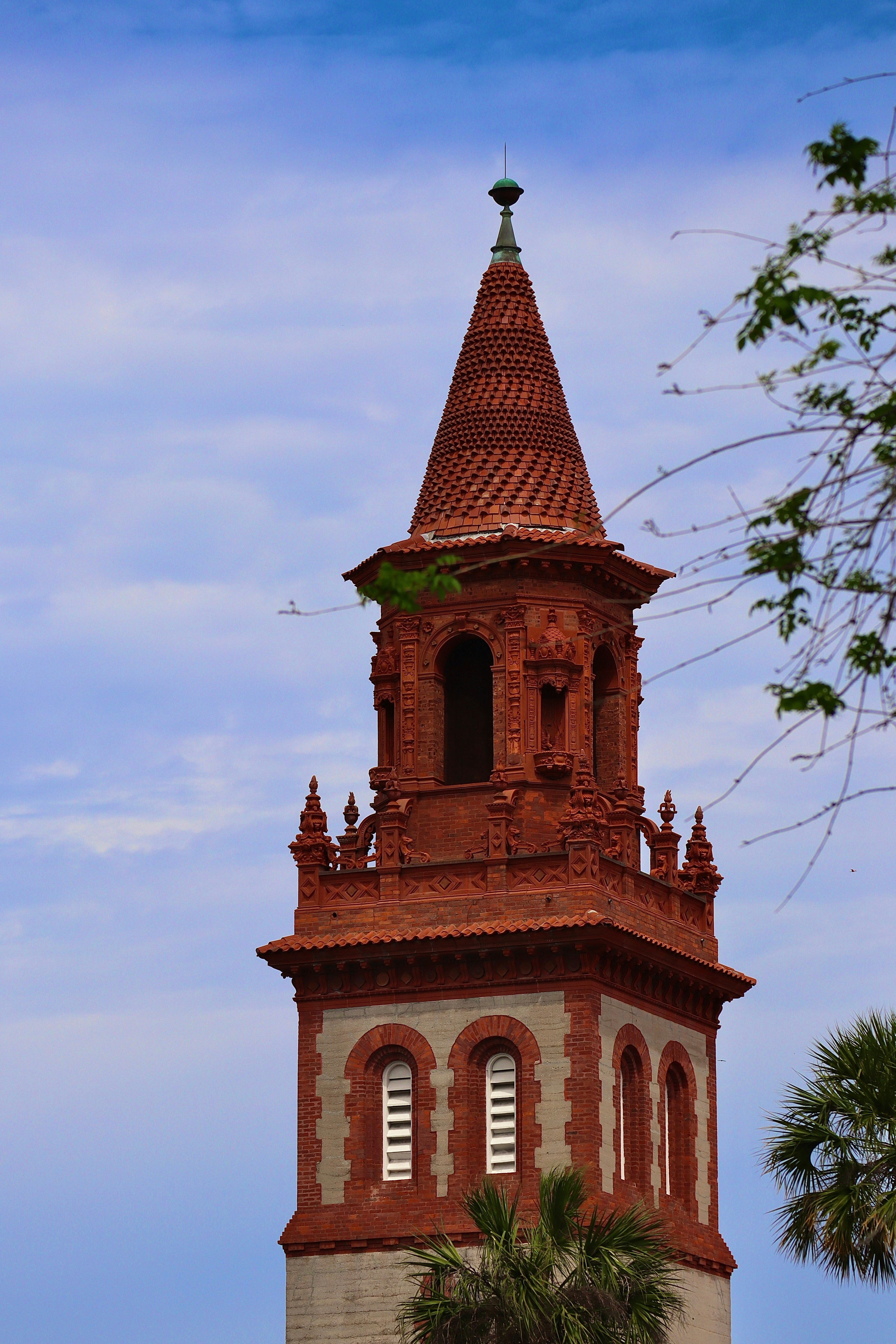 Red Brick Bell Tower Rises Against a Caribbean Blue Sky