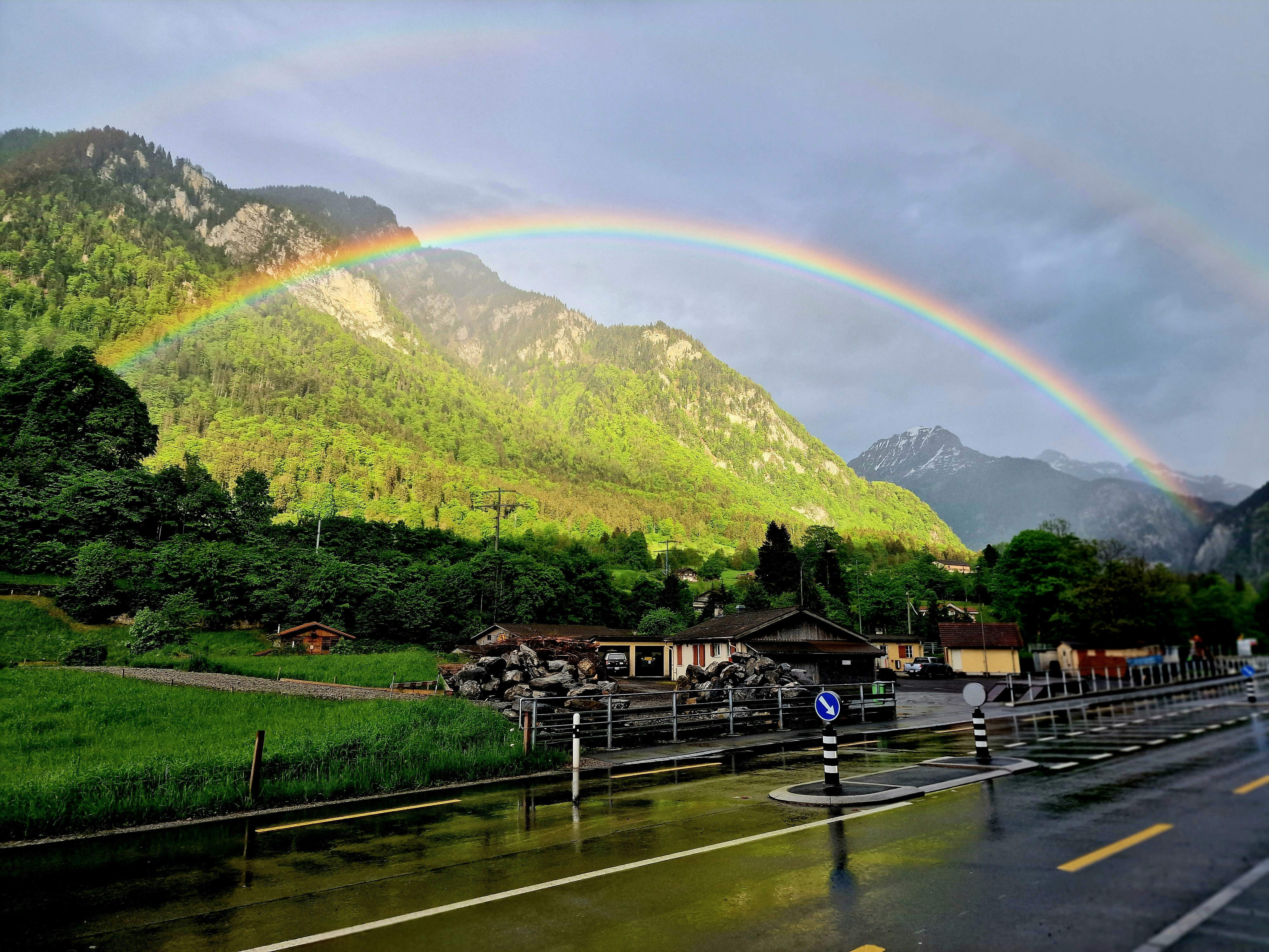 Double Rainbow Over an Alpine Valley