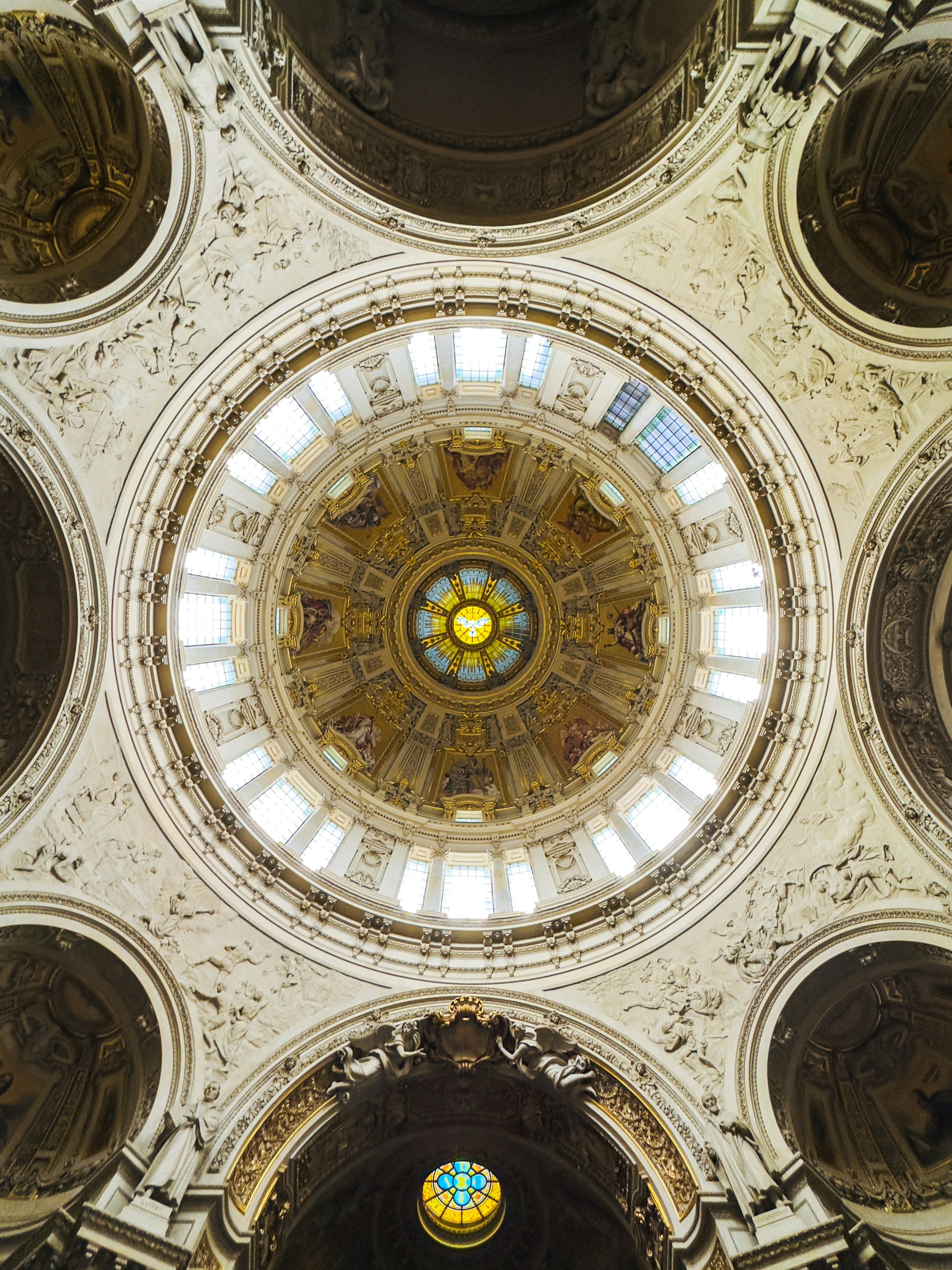 The ceiling of a church with a dome and a stained glass window photo ...