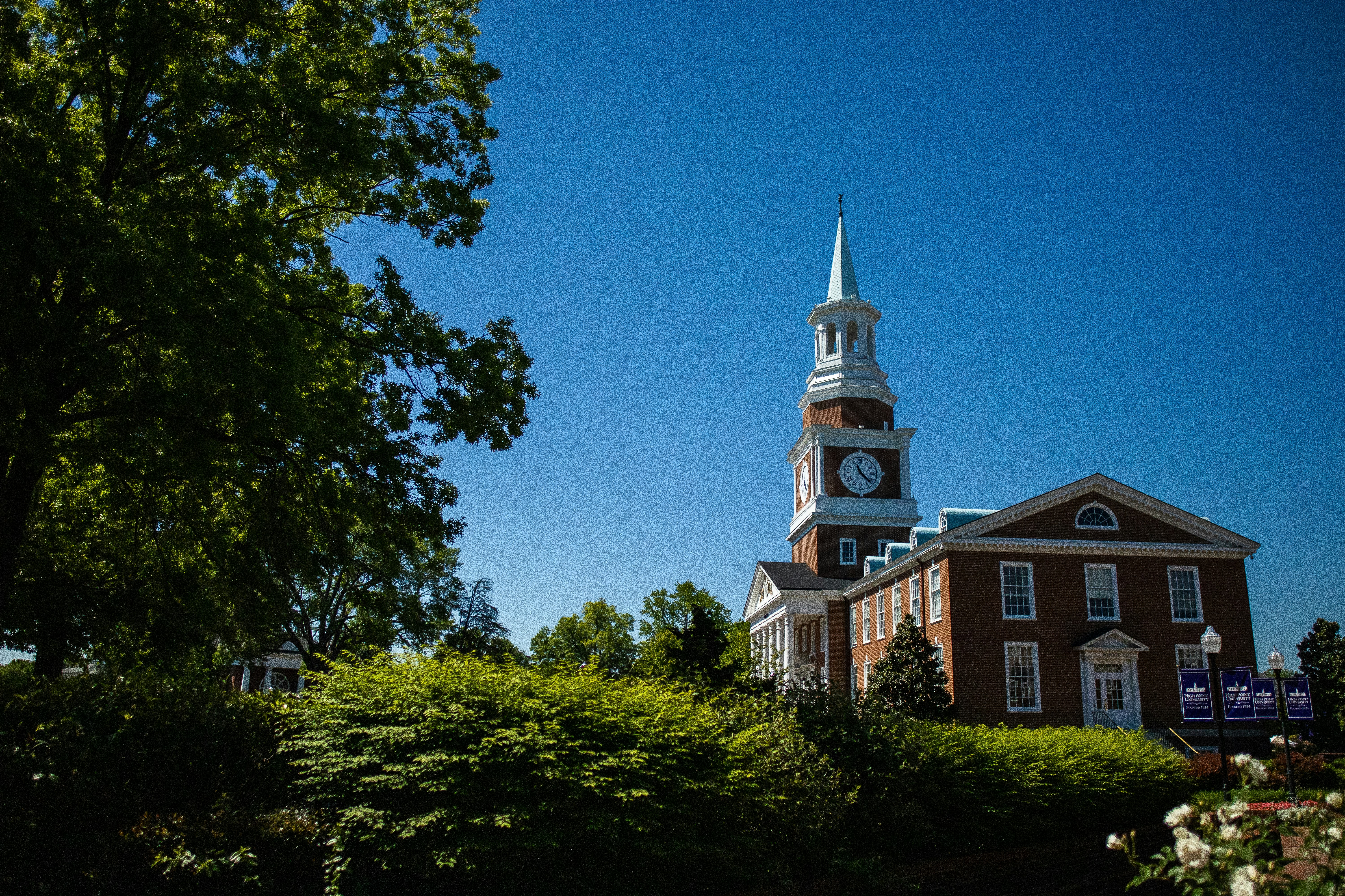 A church with a steeple and a clock tower photo – Free Building Image ...
