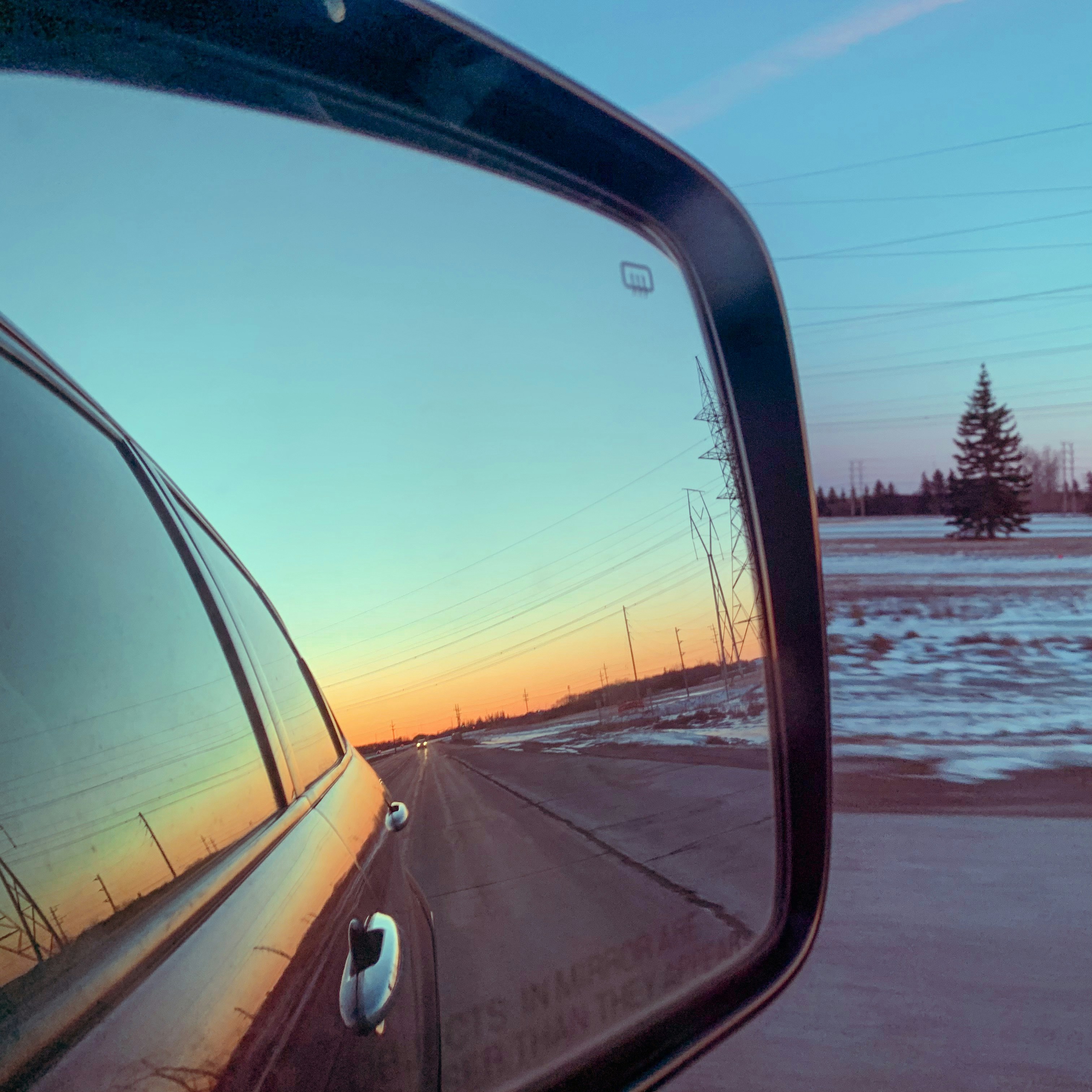 A rear view mirror on a car reflecting a sunset photo – Free Canada ...
