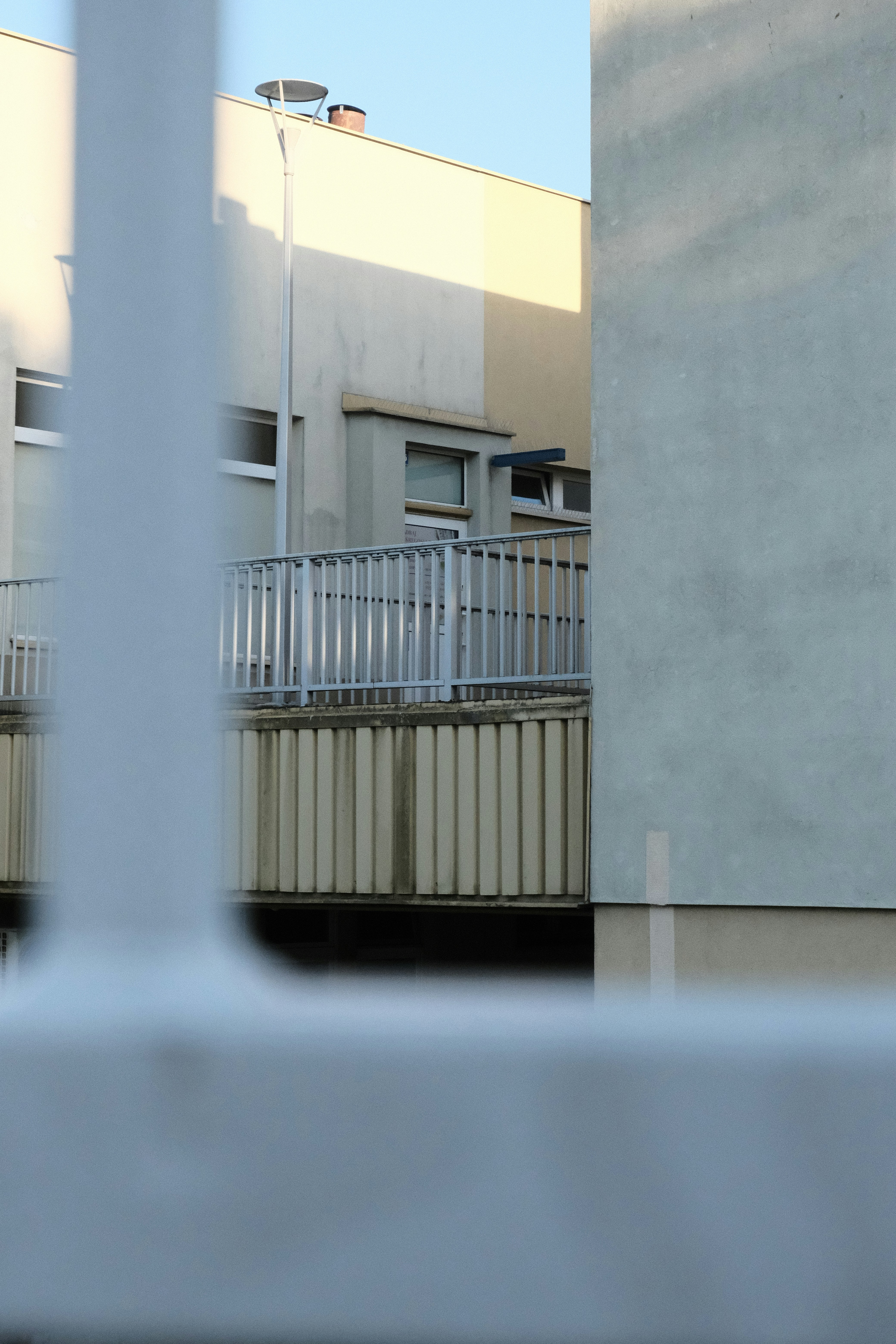 A residential apartment block standing tall amidst the urban landscape, representing community living and modern urban architecture.