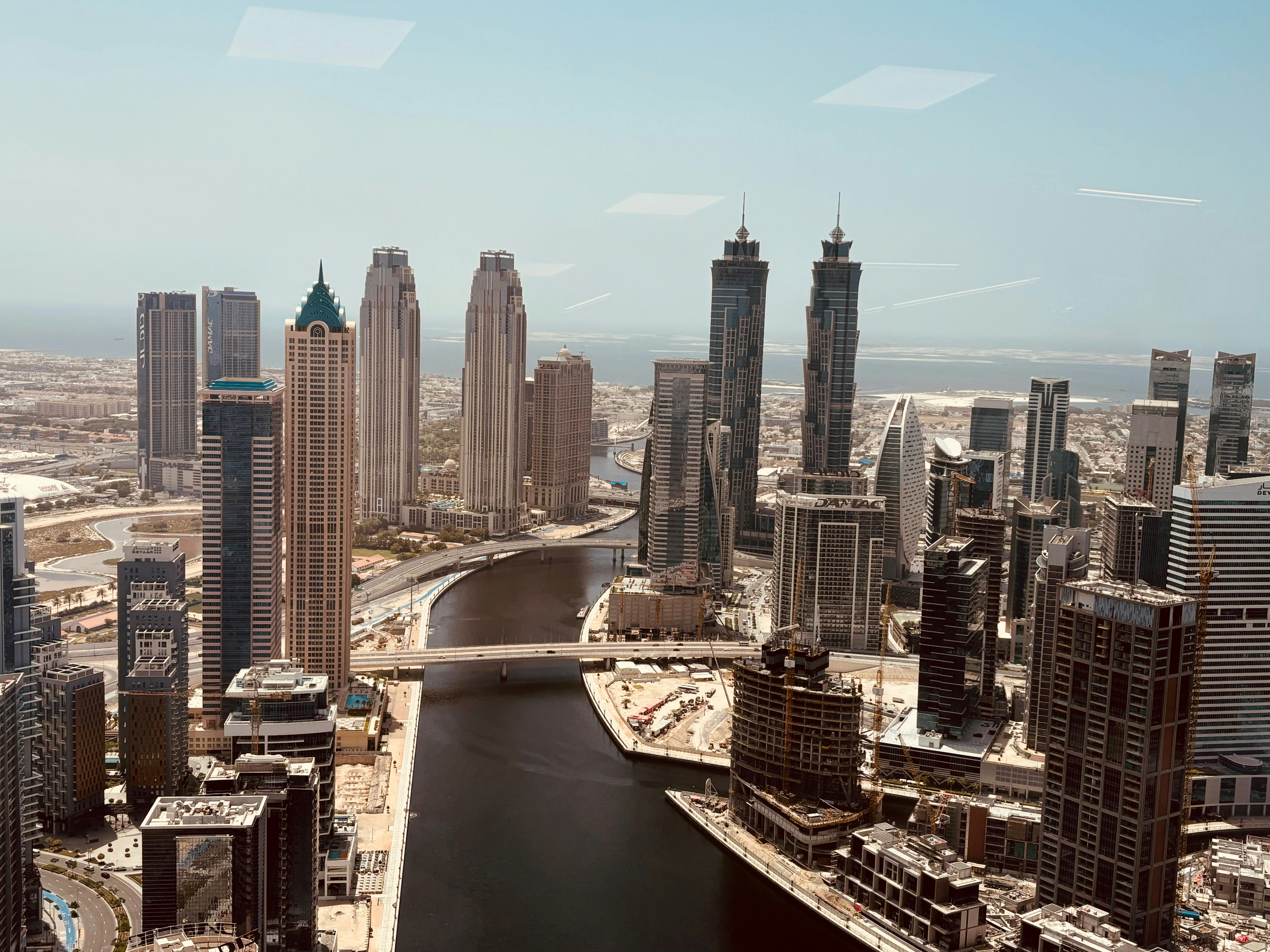 A river running through a city next to tall buildings photo – Free ...