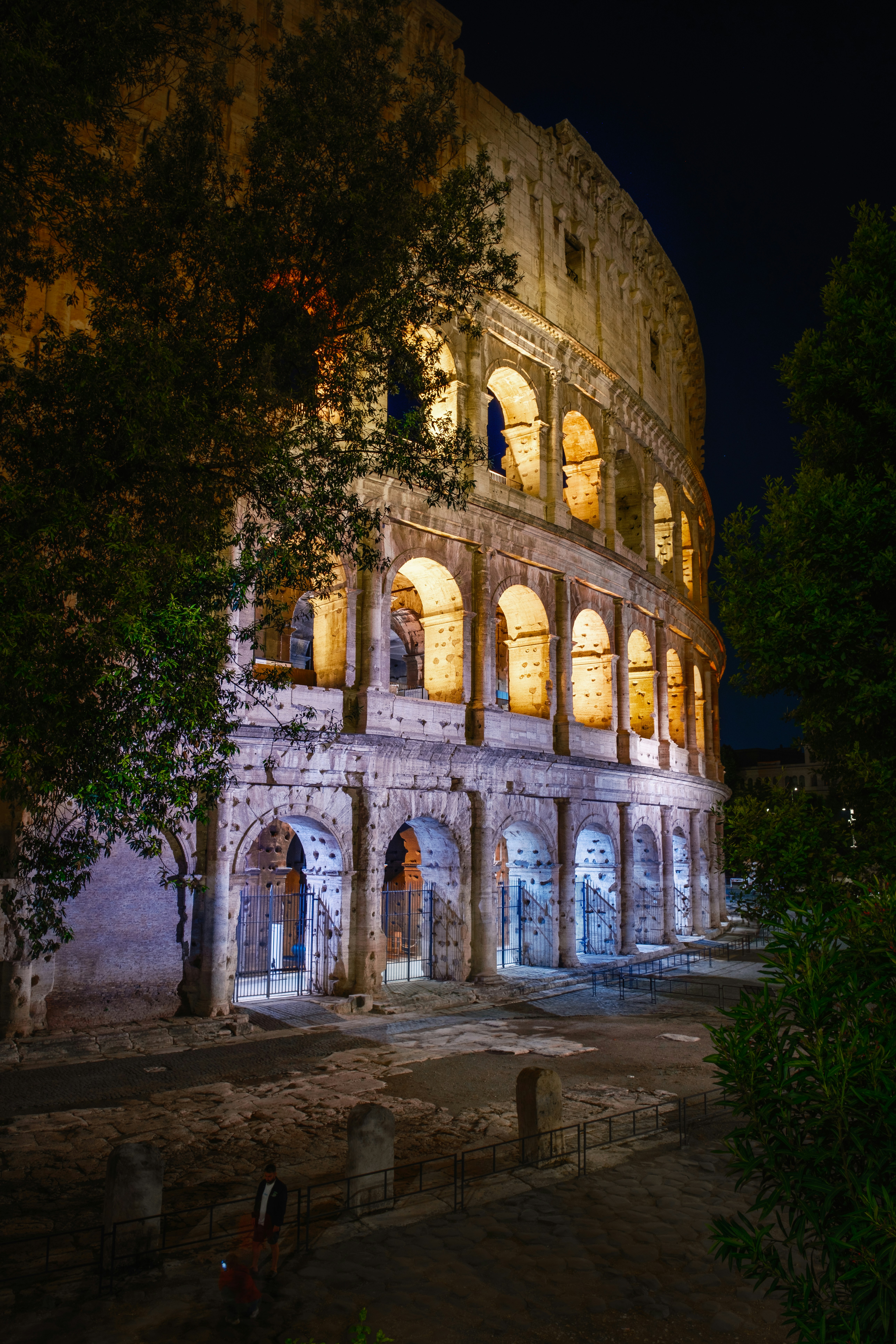 Moonlit Colosseum: Night Portrait of Ancient Arches