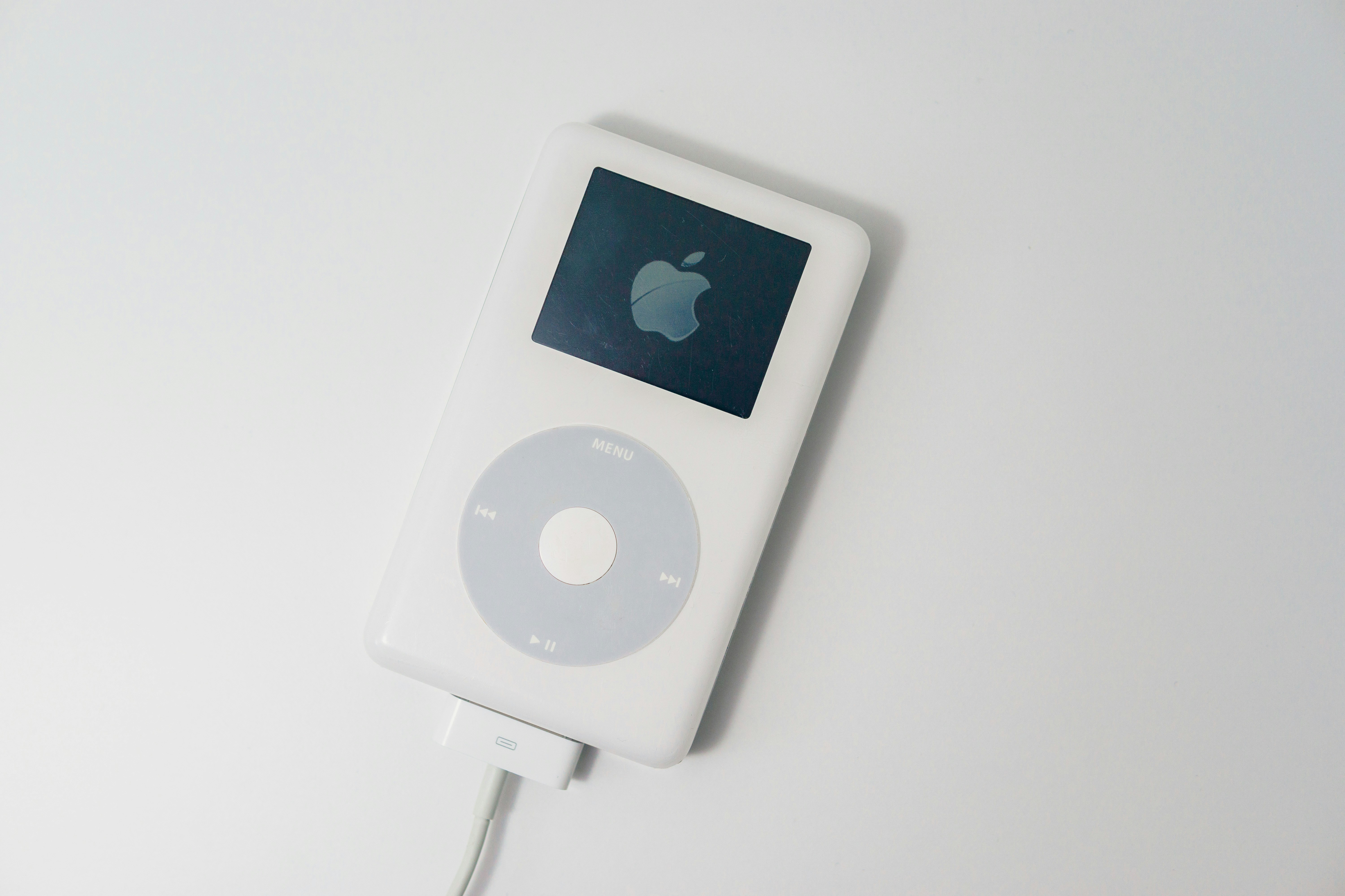 An Ipod Is Plugged Into A Charger Photo Free Electronics Image On