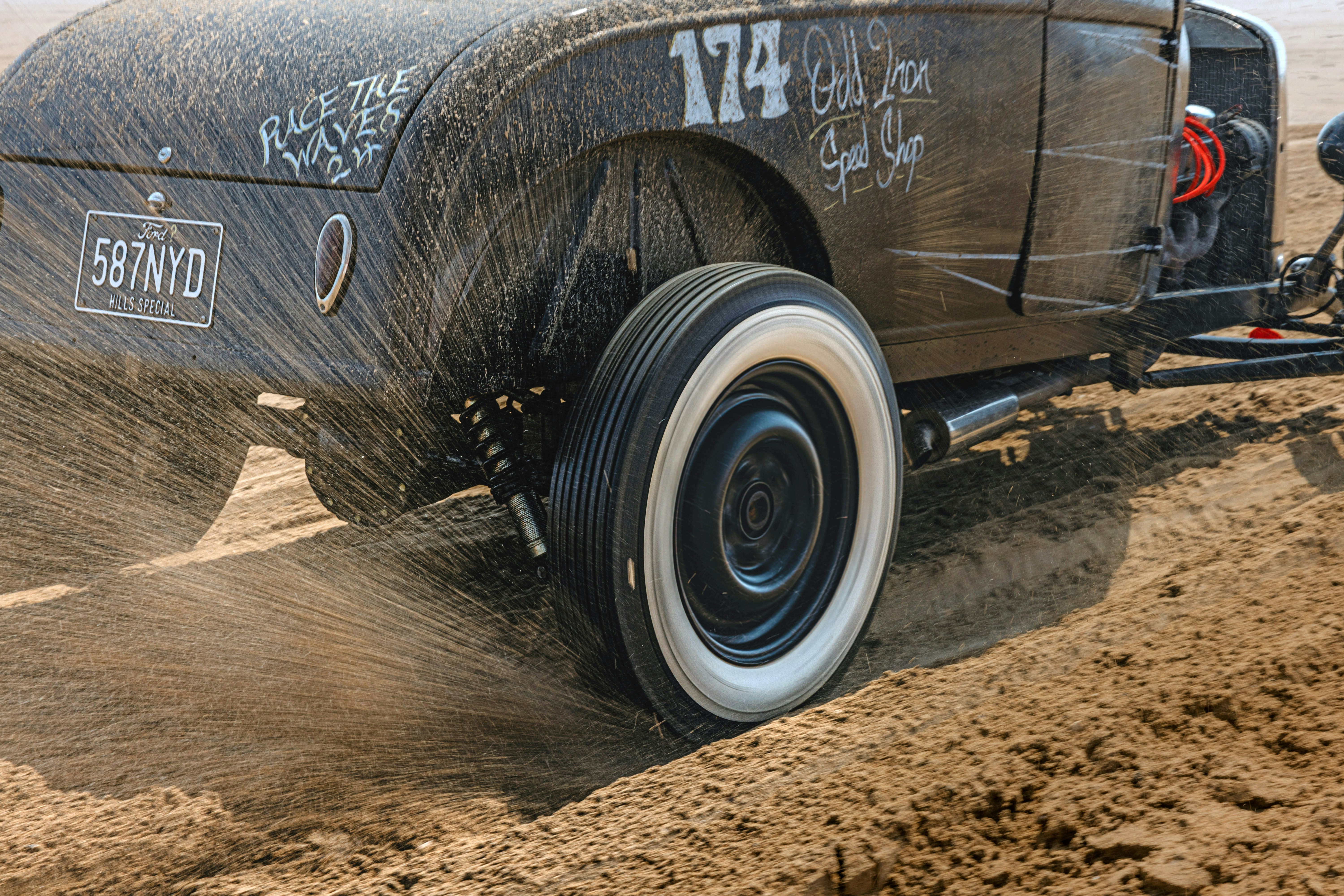 Dustbound Wheels: A vintage pickup carves through desert churn