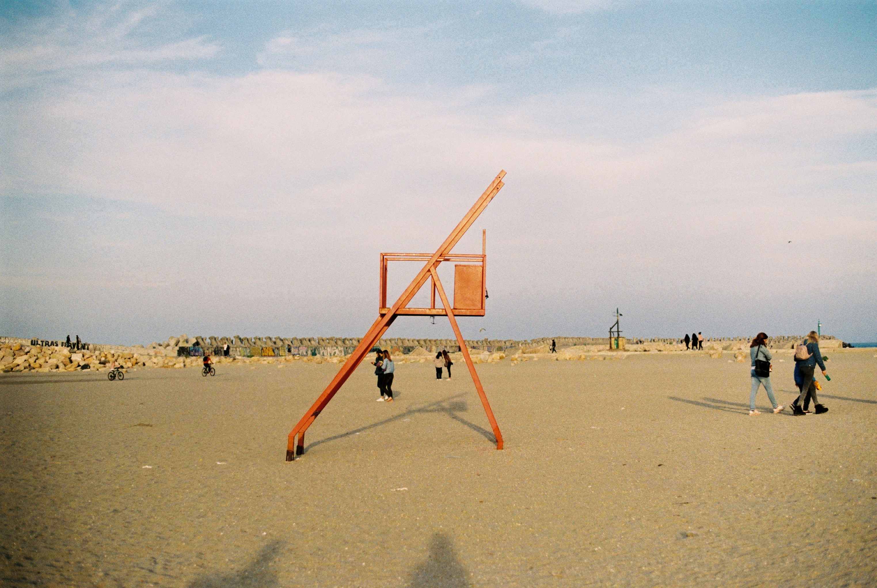 Geometry at the Tide: The Beach's A-Frame Framing a Quiet Horizon
