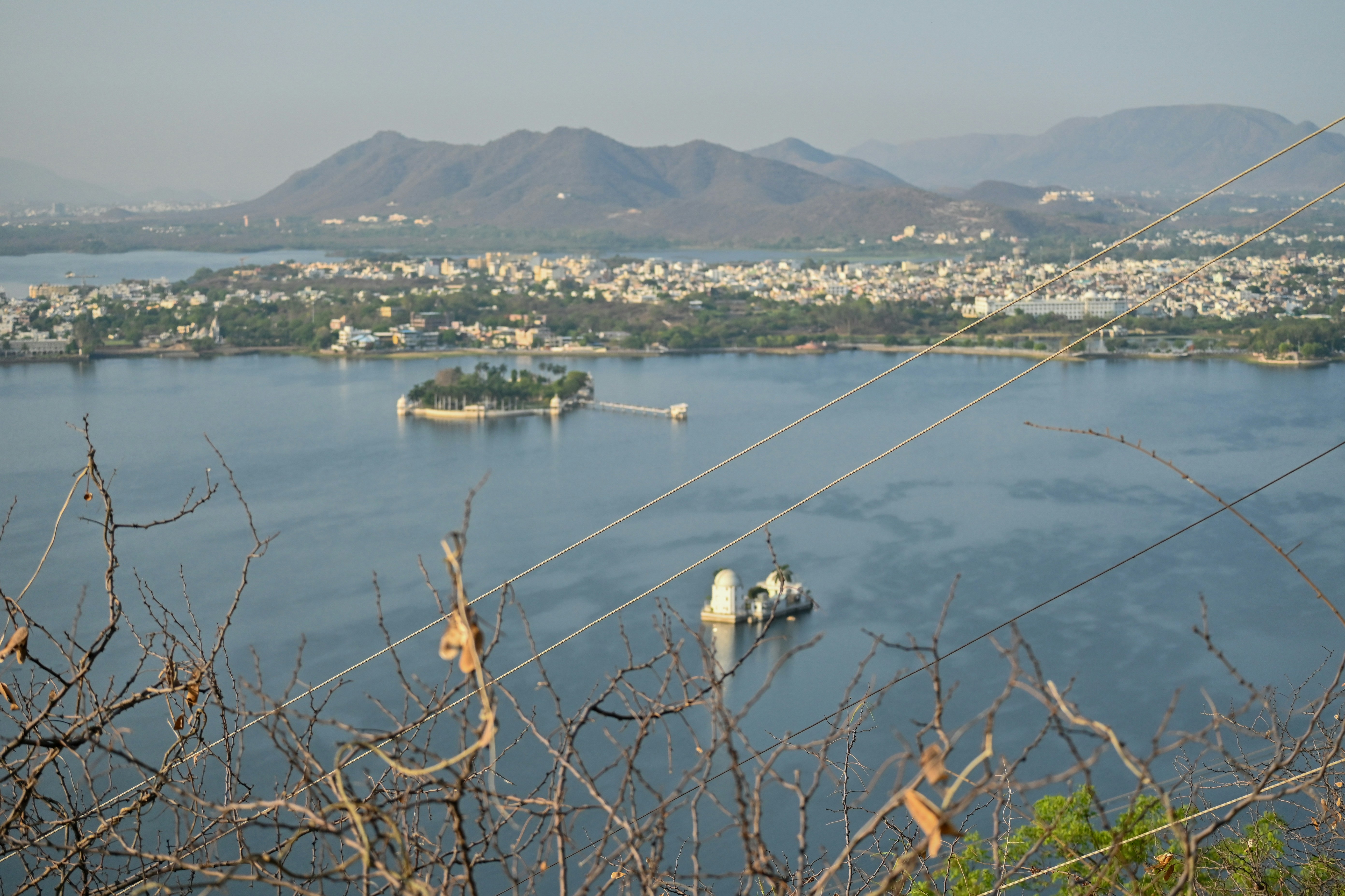 Islet in a Quiet Bay Beneath Distant Peaks