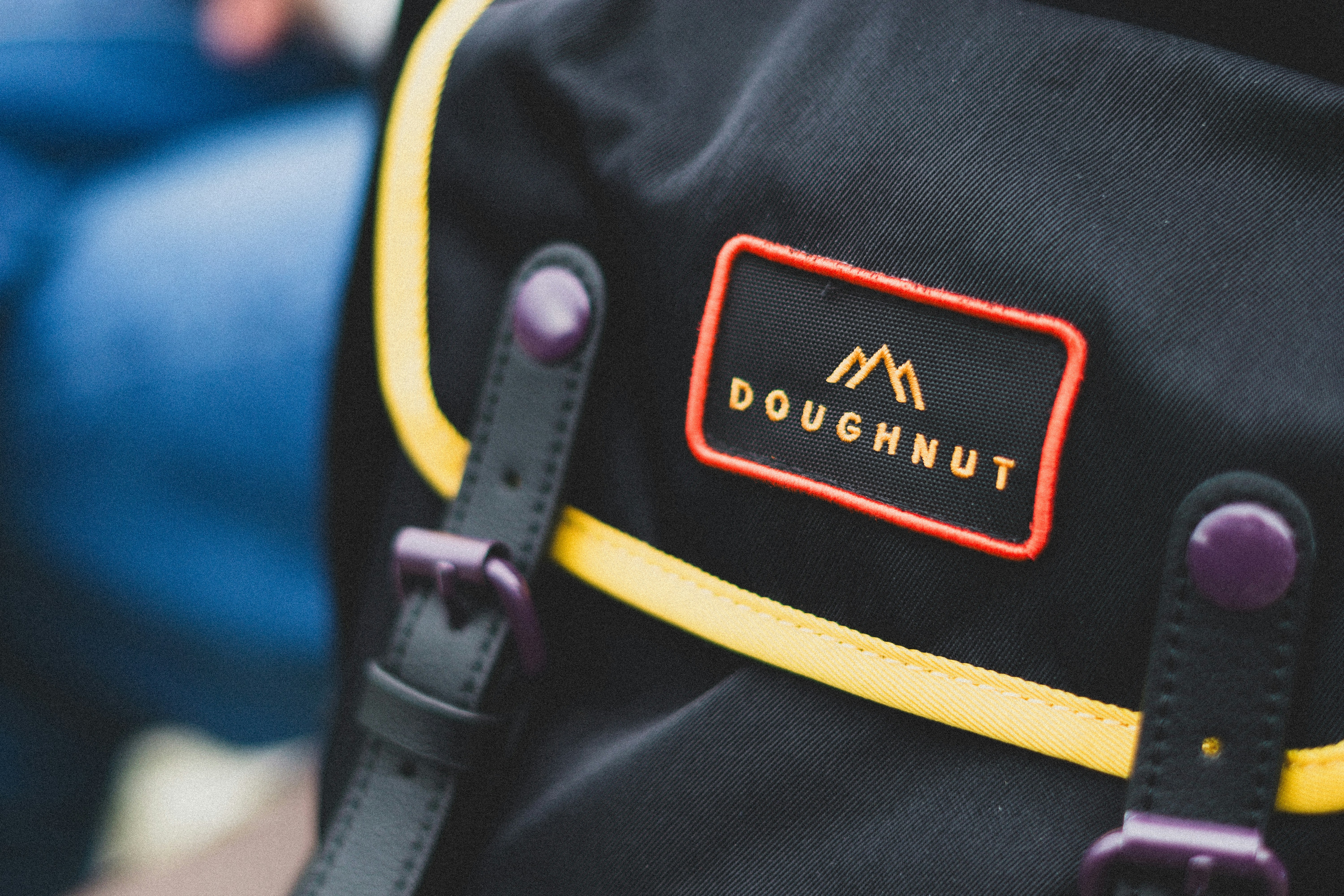 A close up of a black and yellow backpack photo – Free Backpack Image ...