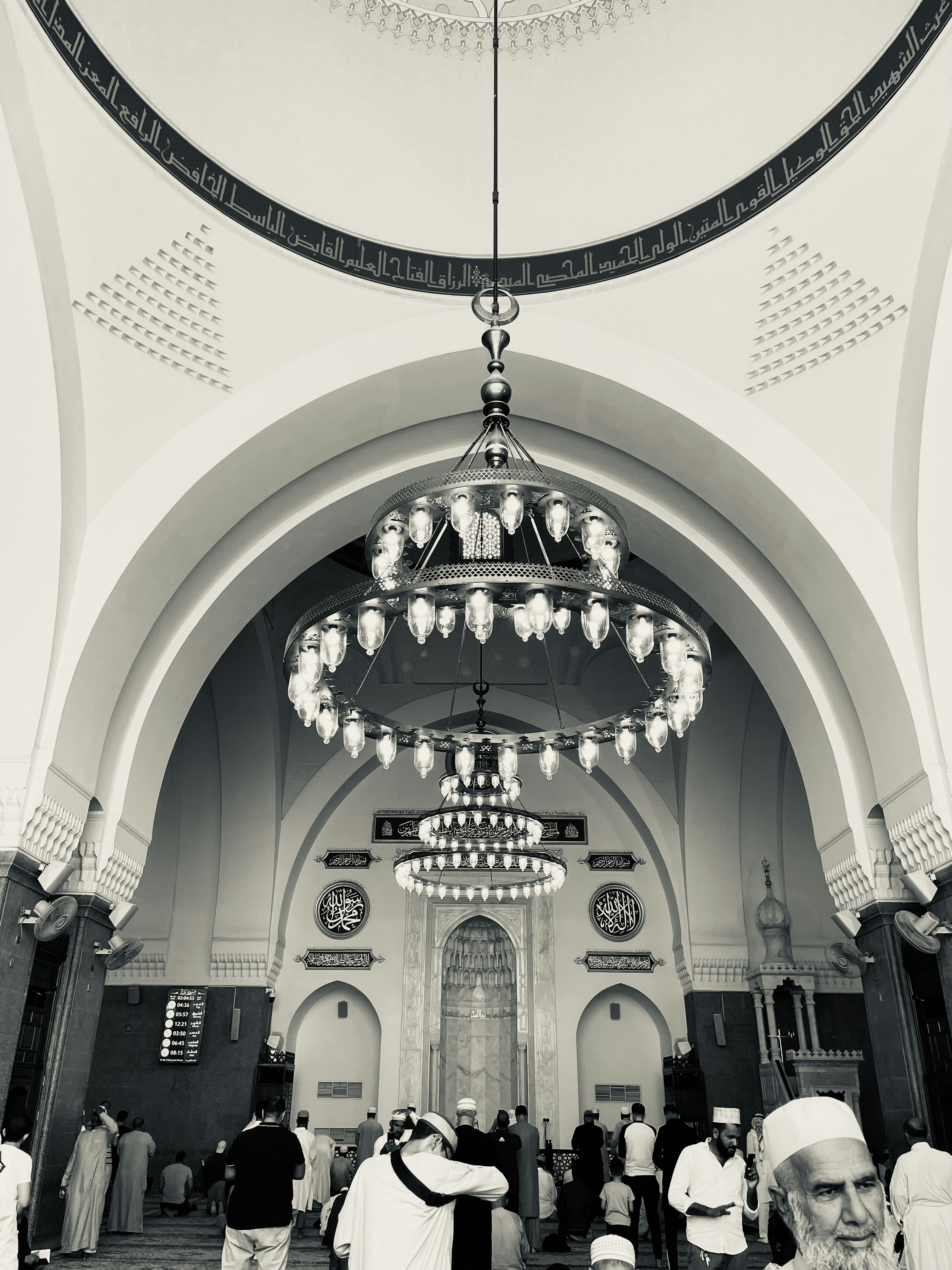 A group of people standing in a large building photo – Free Masjid quba ...
