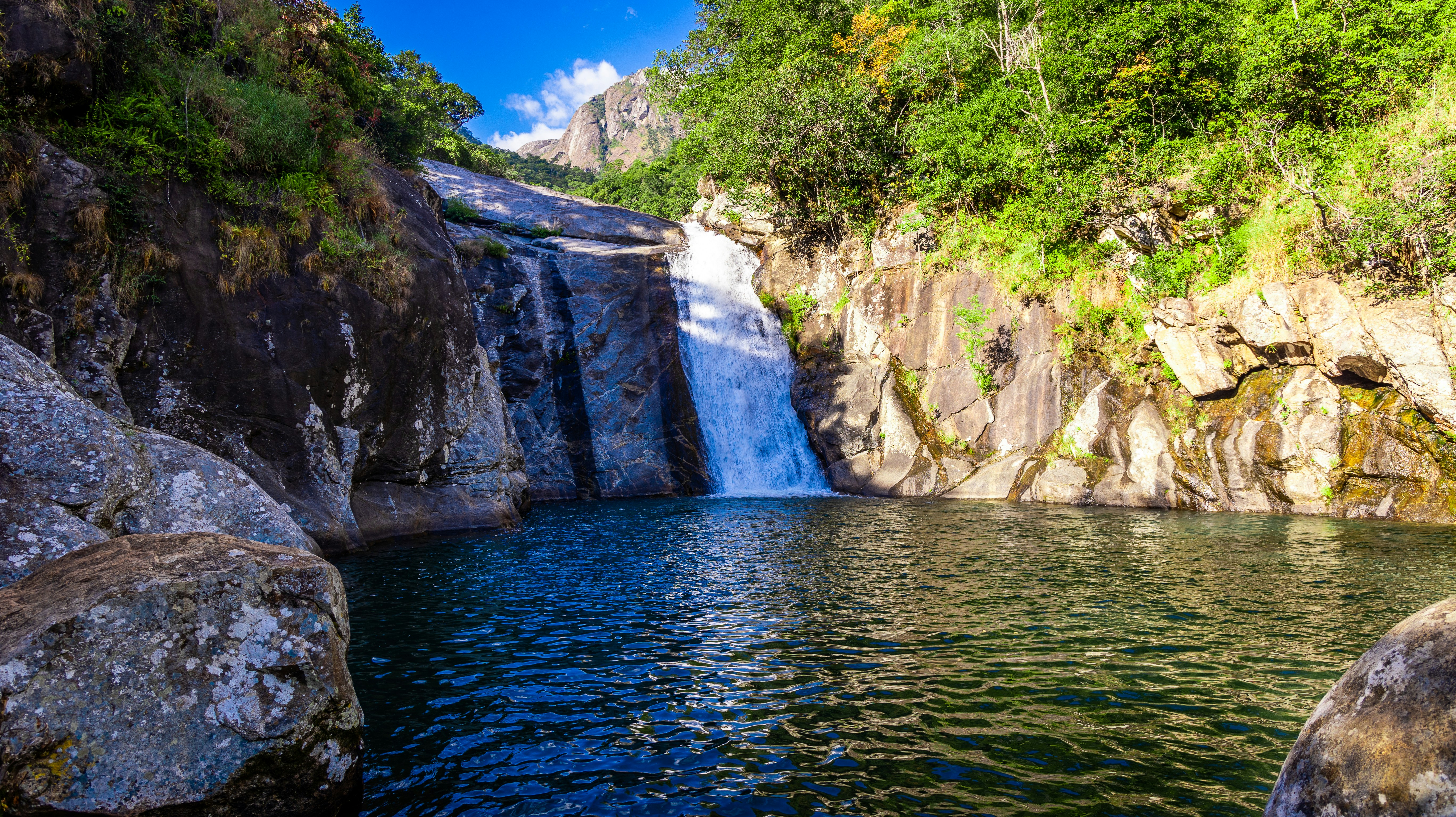 A large waterfall with a waterfall in the middle of it photo – Free ...