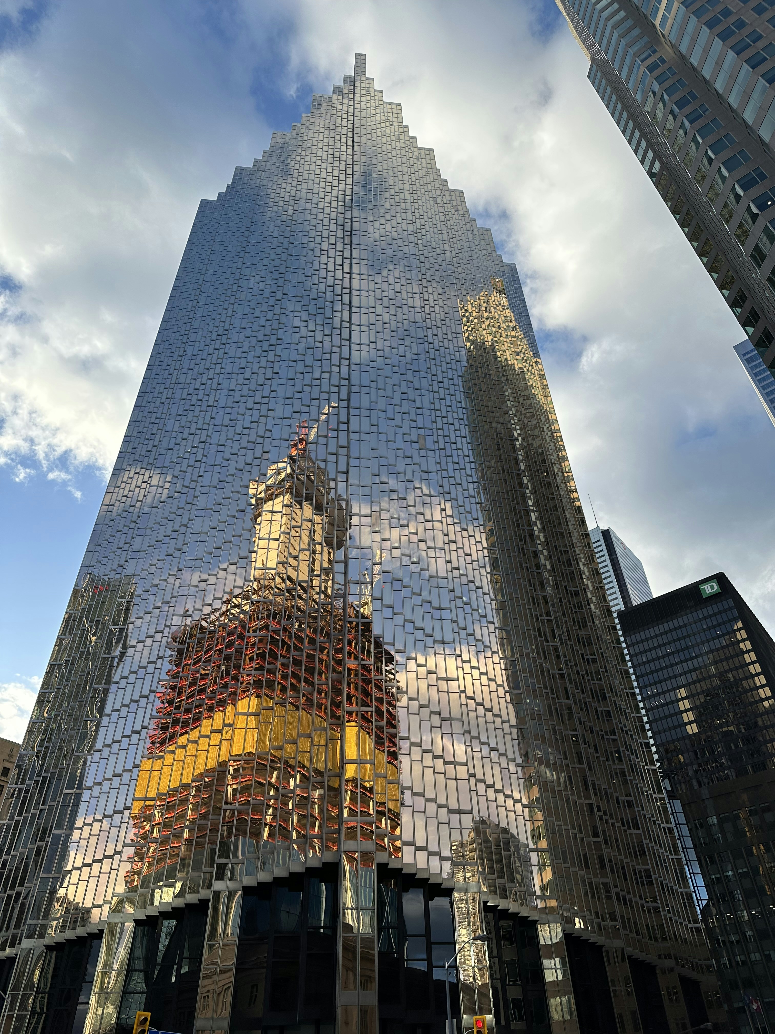 Crown of Glass: Sky Reflections in a Towering Facade