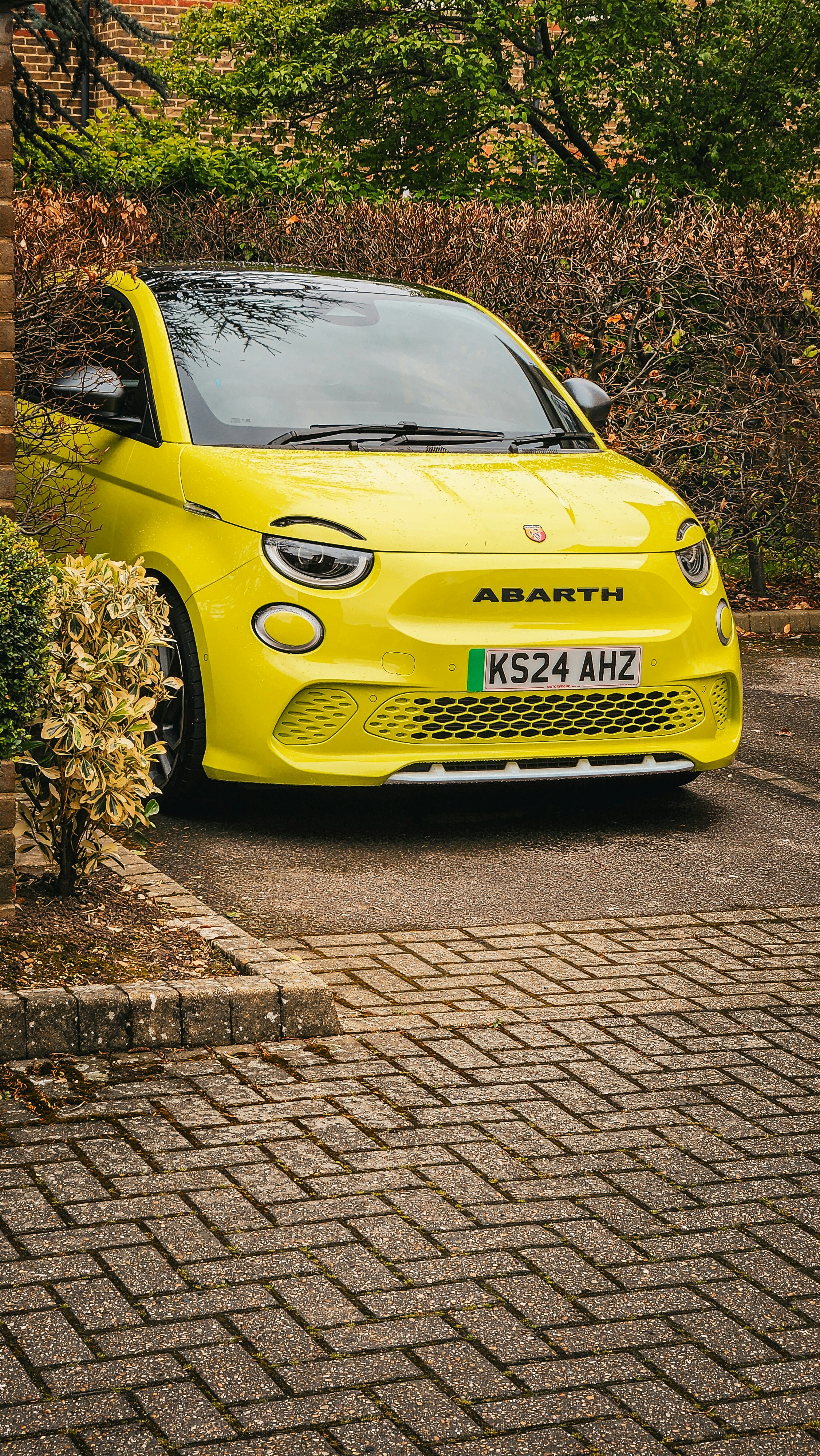Neon Bolt in a Quiet Parking Lot: Abarth's Bold Yellow Stance