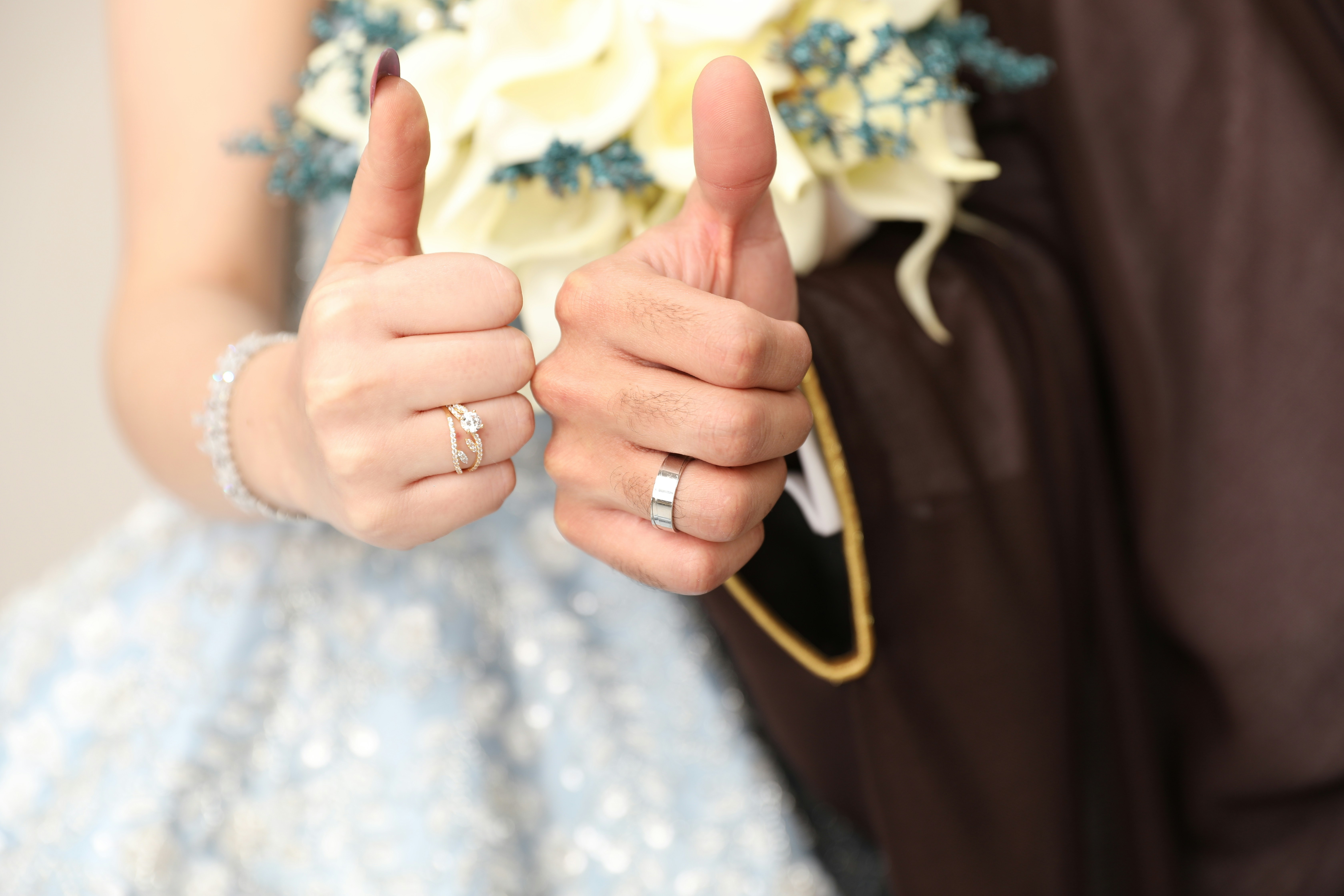 Double Thumbs Up at the Altar: Rings, Lace, and Shared Joy