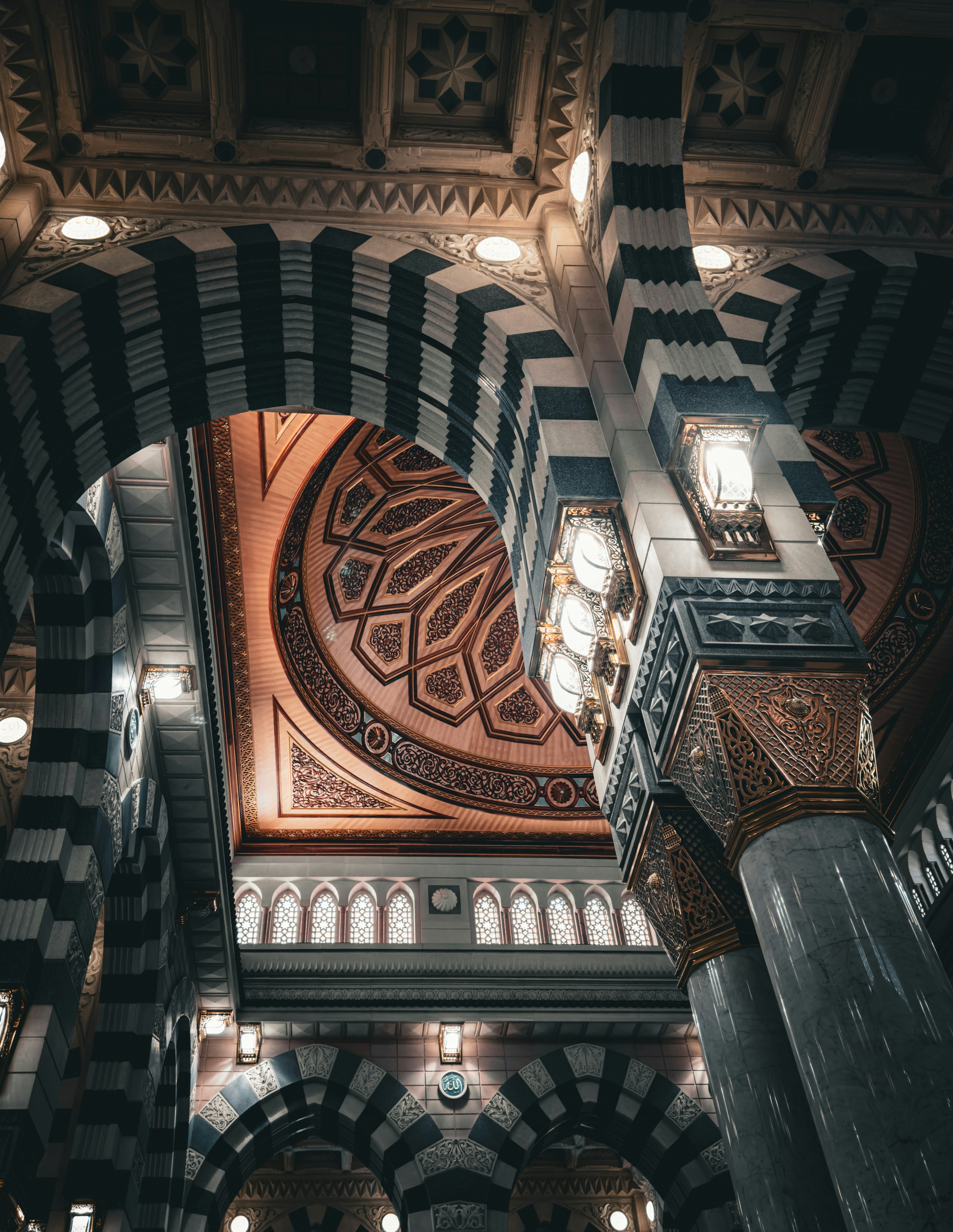 Arched Corridor of alternating Stone: A Gothic-M Moorish Gallery at Dusk